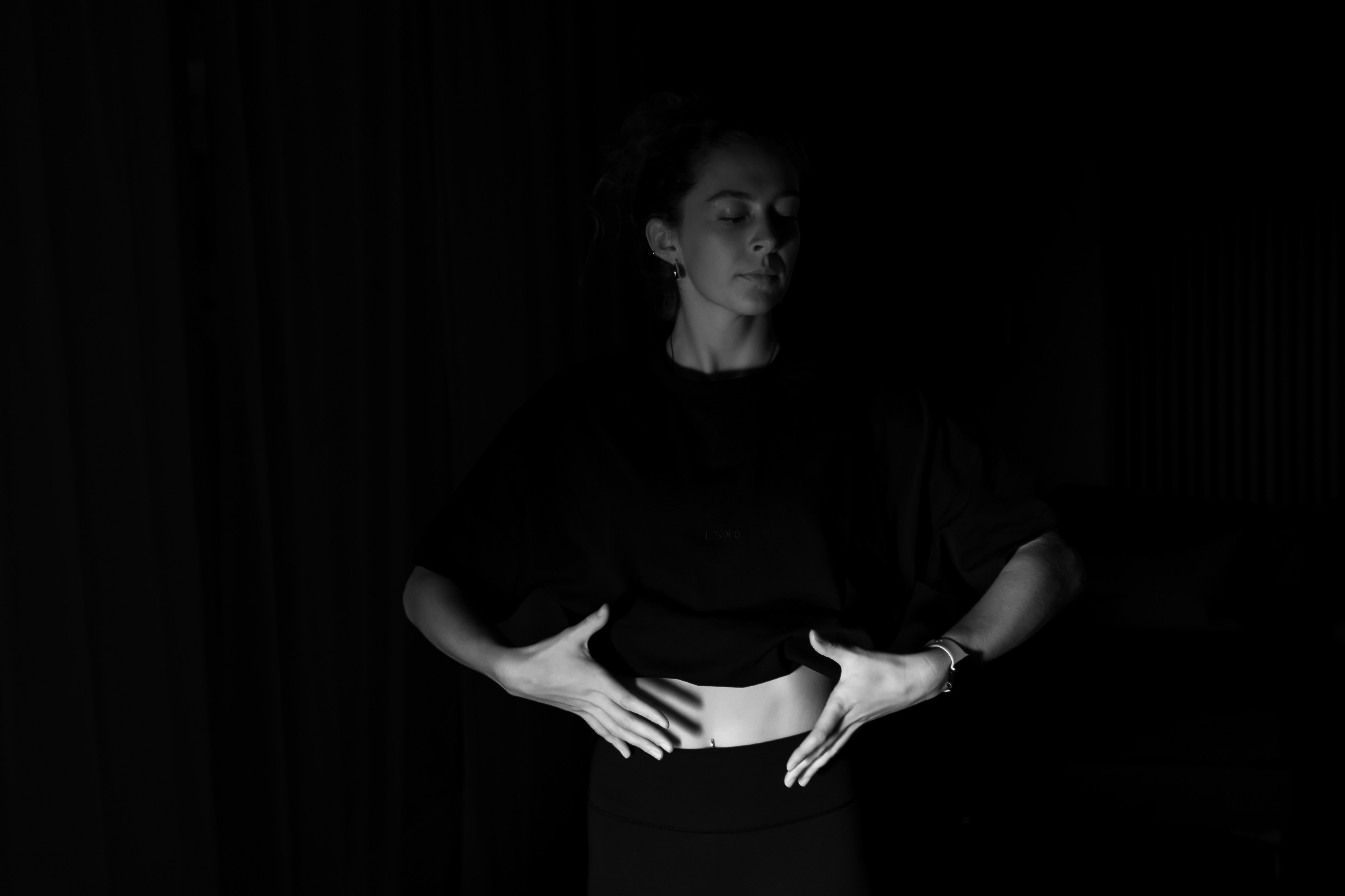 Silhouette of Confidence: A Quiet Pose in Low Light