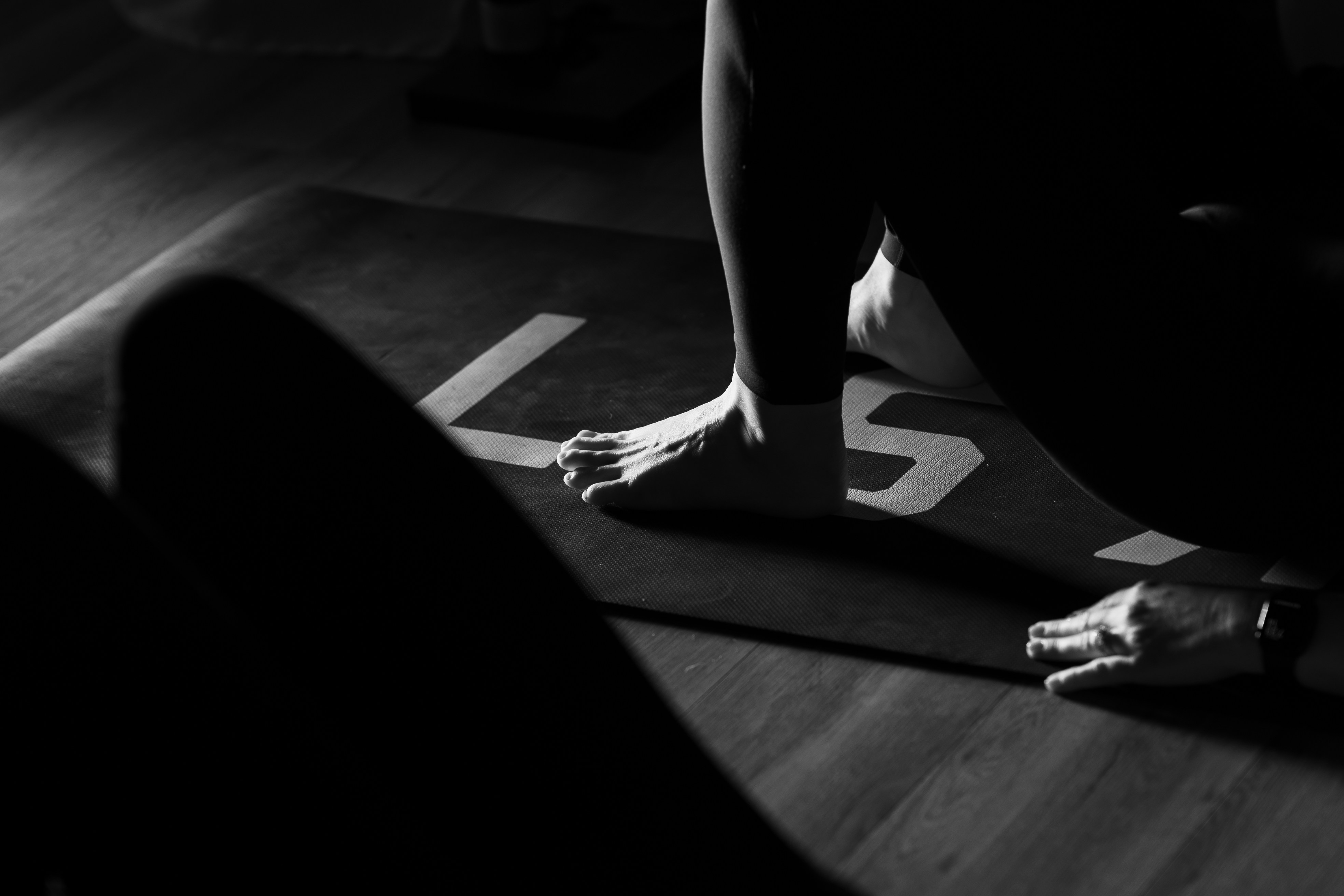 Focused Breath on the Mat: A Quiet Yoga Moment in Low Light