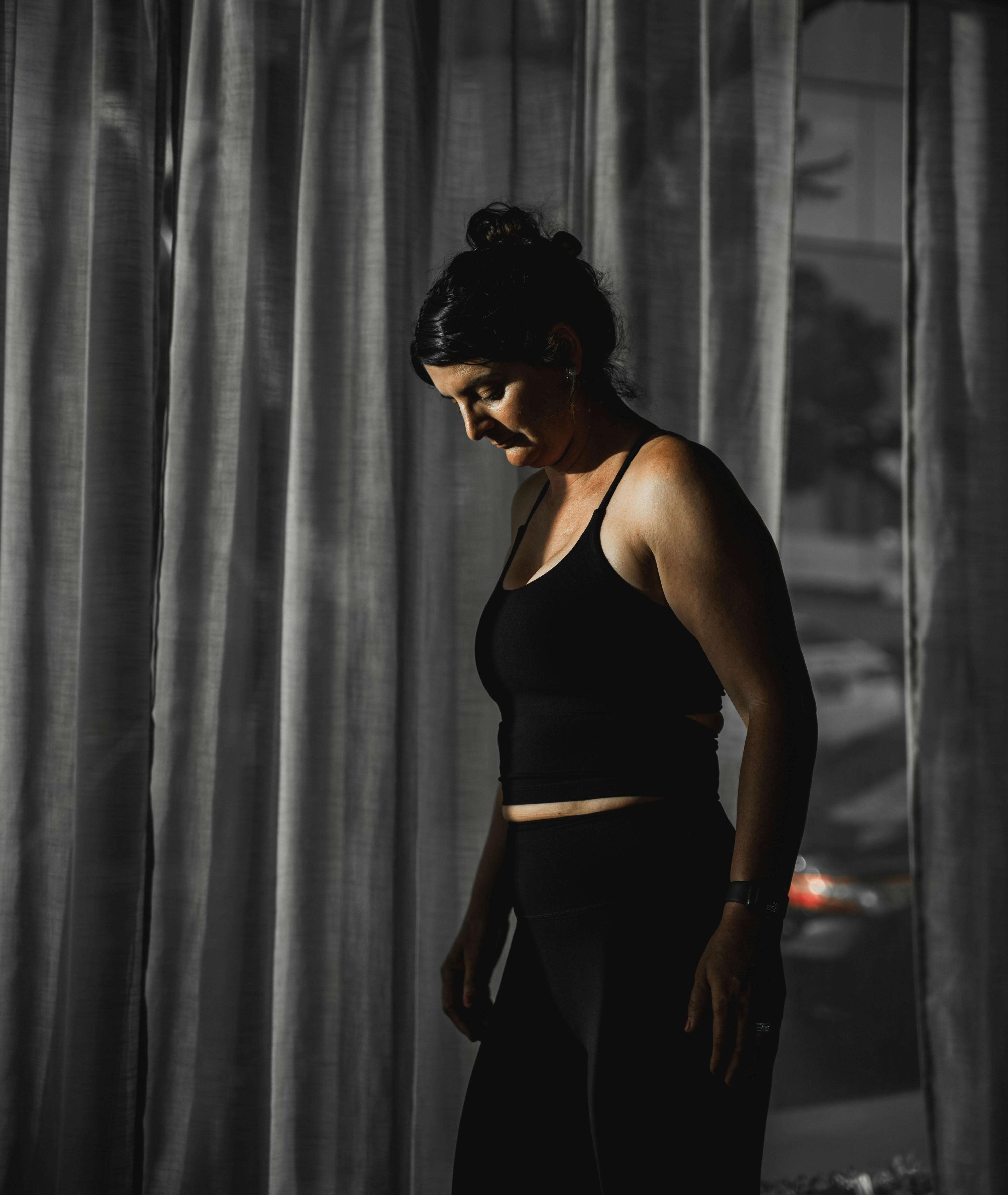 Soft Spotlight: A Quiet Moment in the Curtain Gap