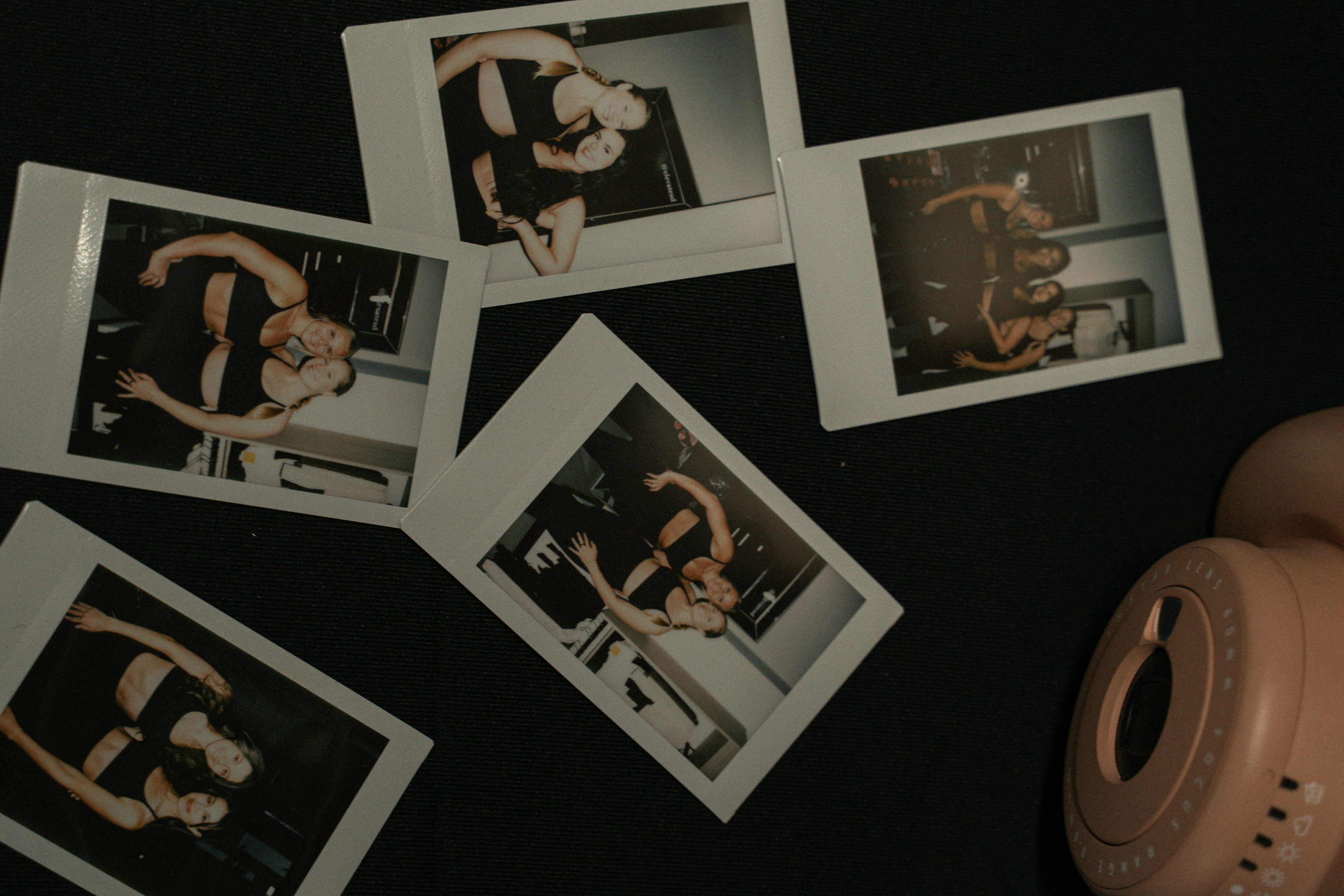 Nostalgic Polaroids Scatter: A Quiet Collage by a Retro Telephone