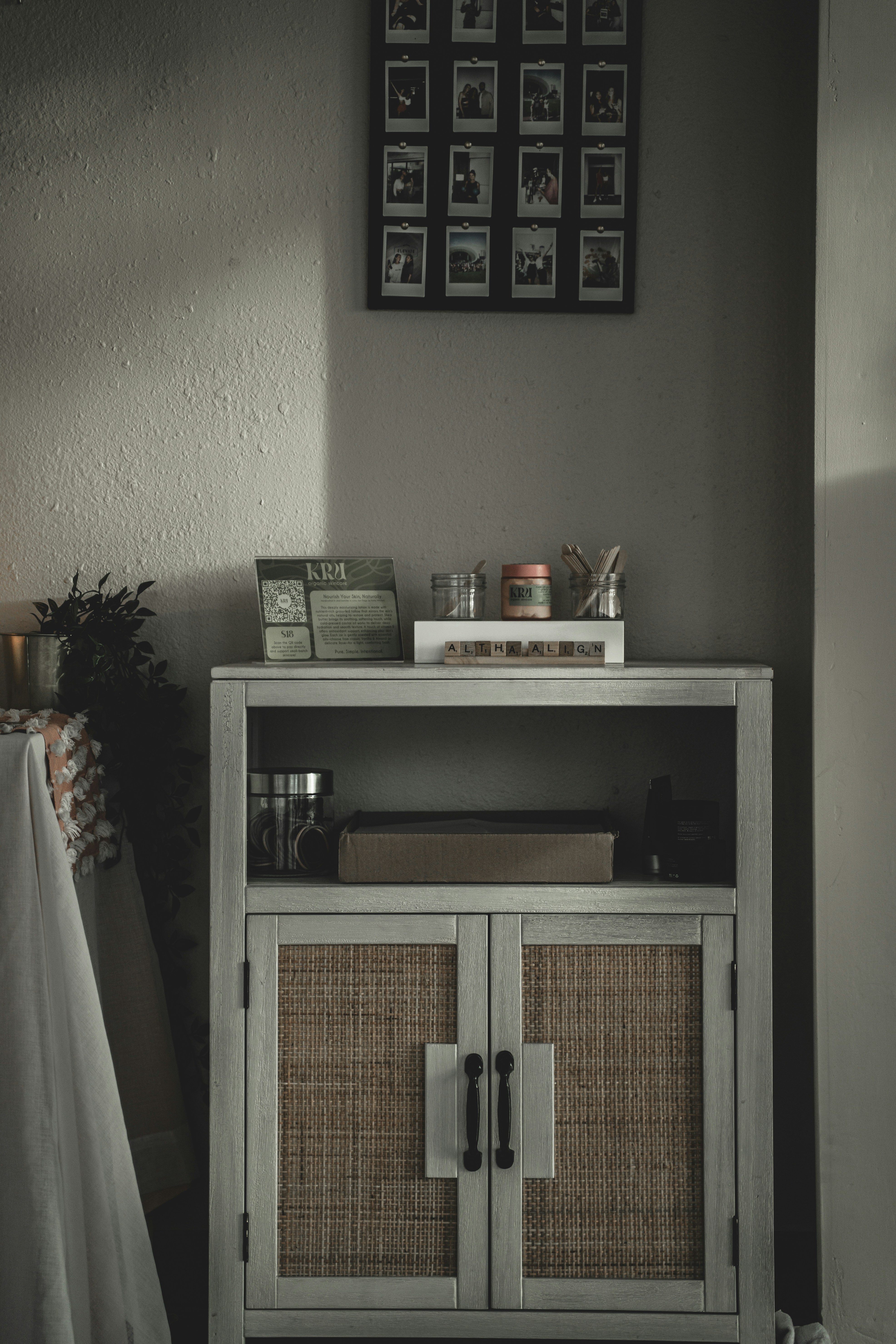 Midtone Shrine: A Confident Cabinet Nestled Under Soft Wall Light