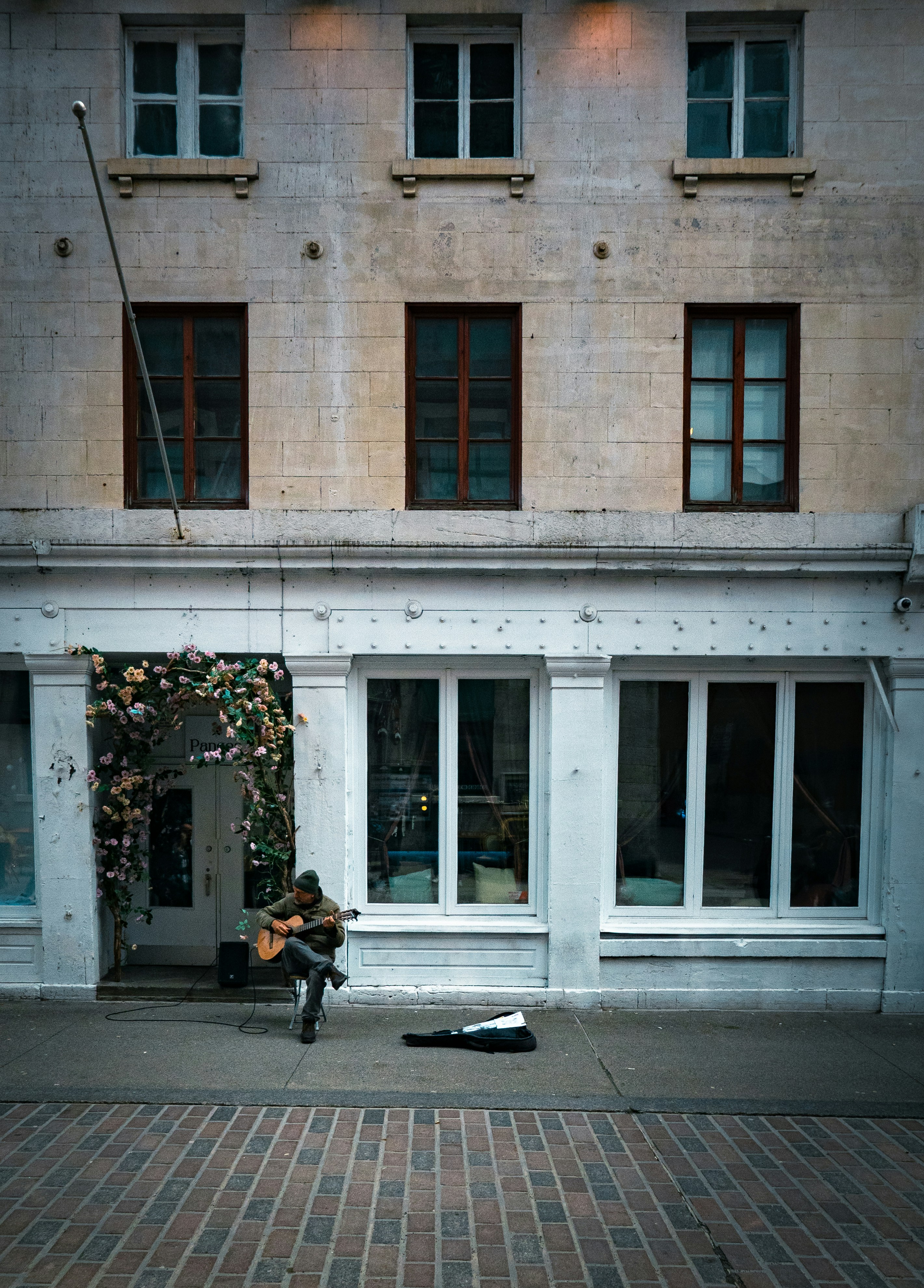 Guitarist in a Doorway: City Street Serenade
