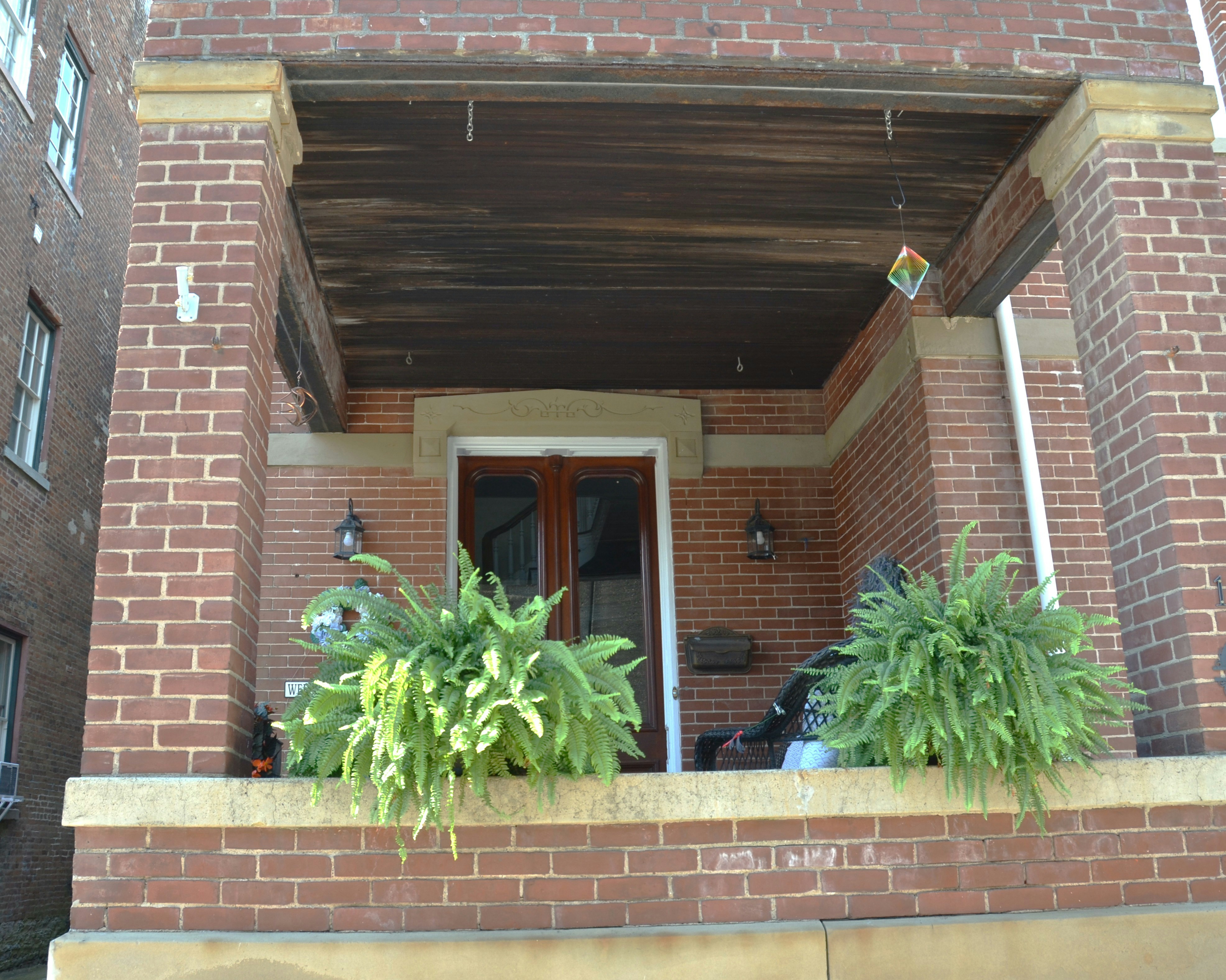 Front Porch Fronds: A Welcoming Balcony in Bloom