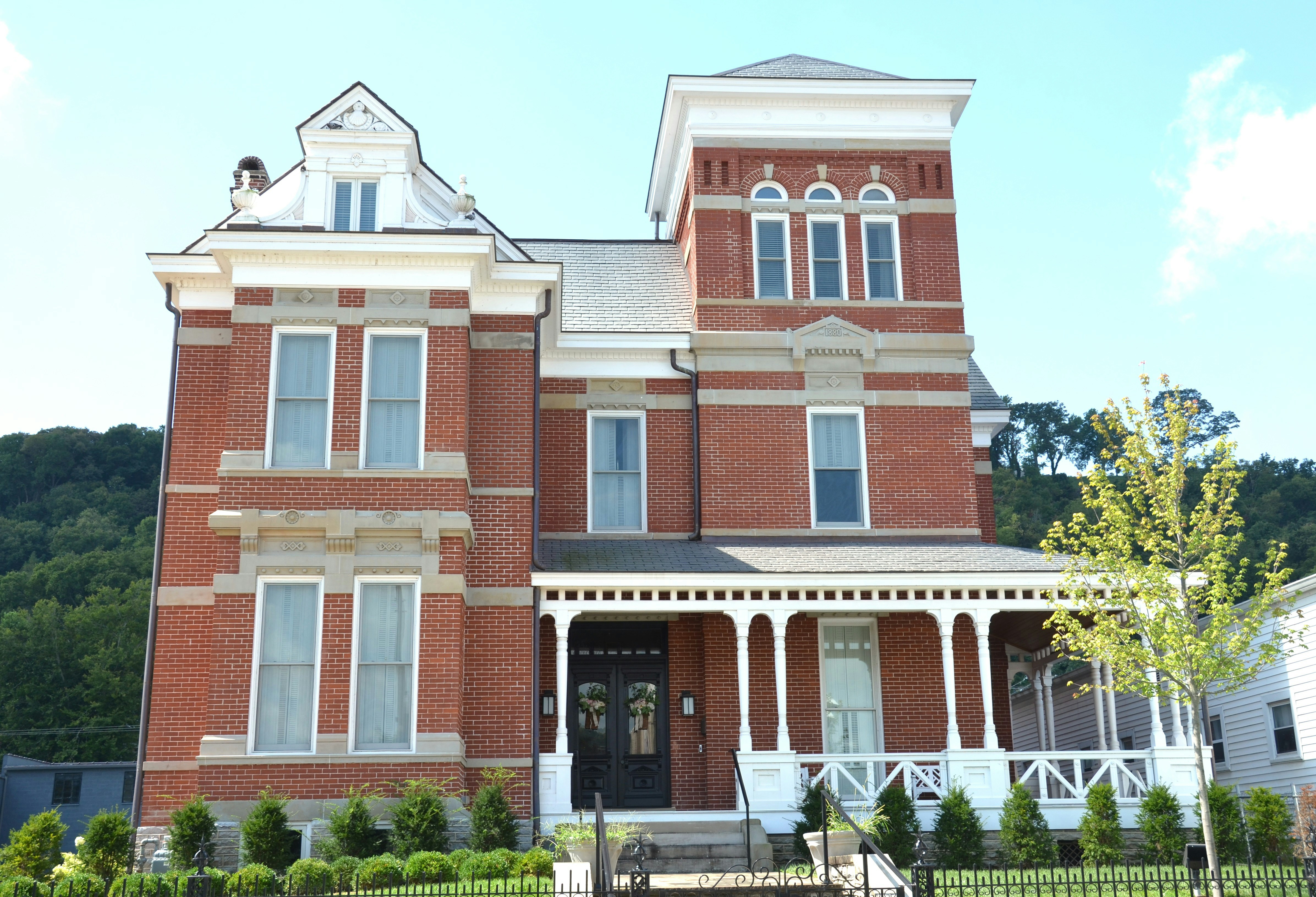 Victorian Brick Villa: A Standalone Manor Under a Bright Sky