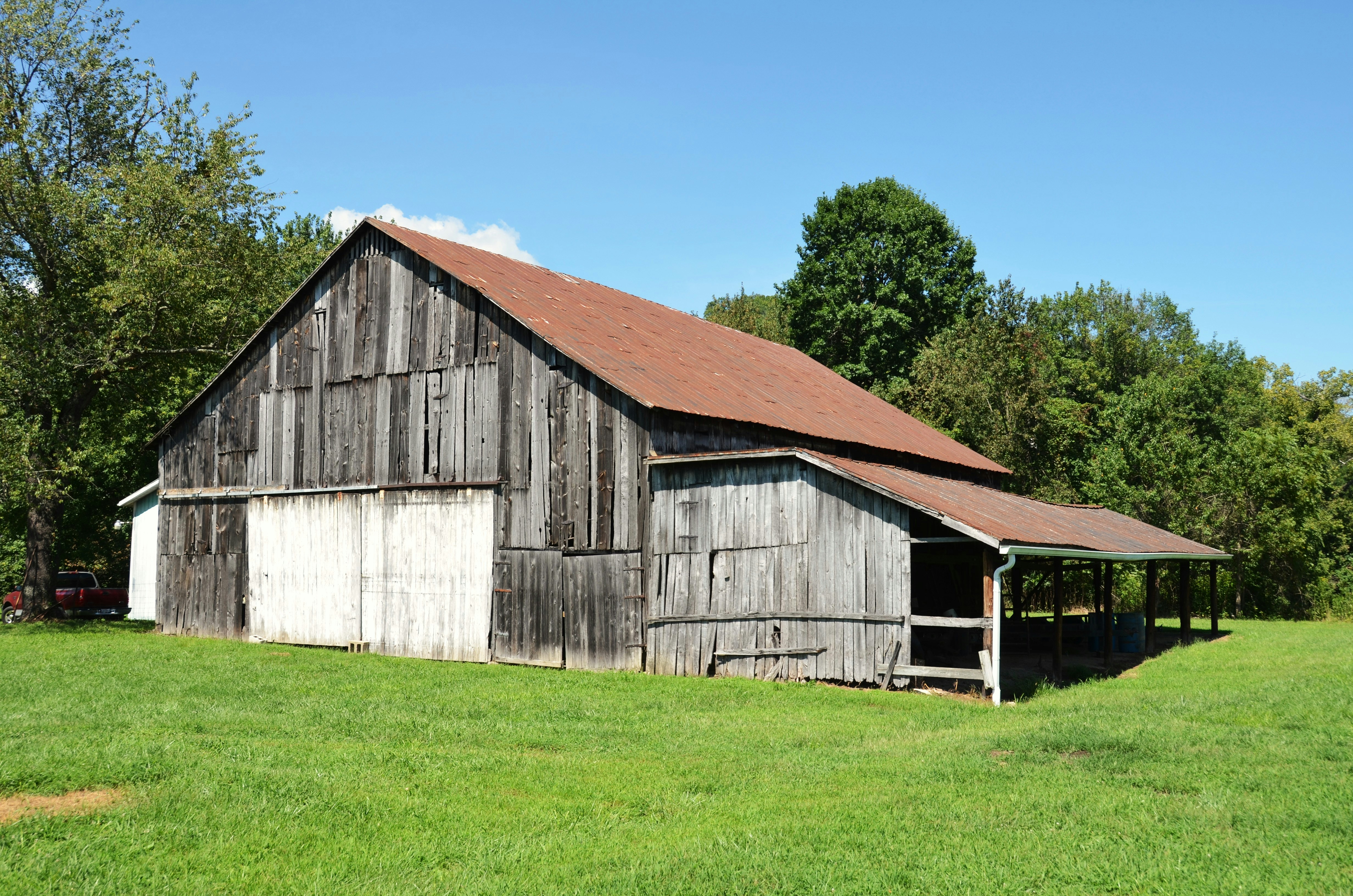 Weathered Barn in Sunlit Pasture