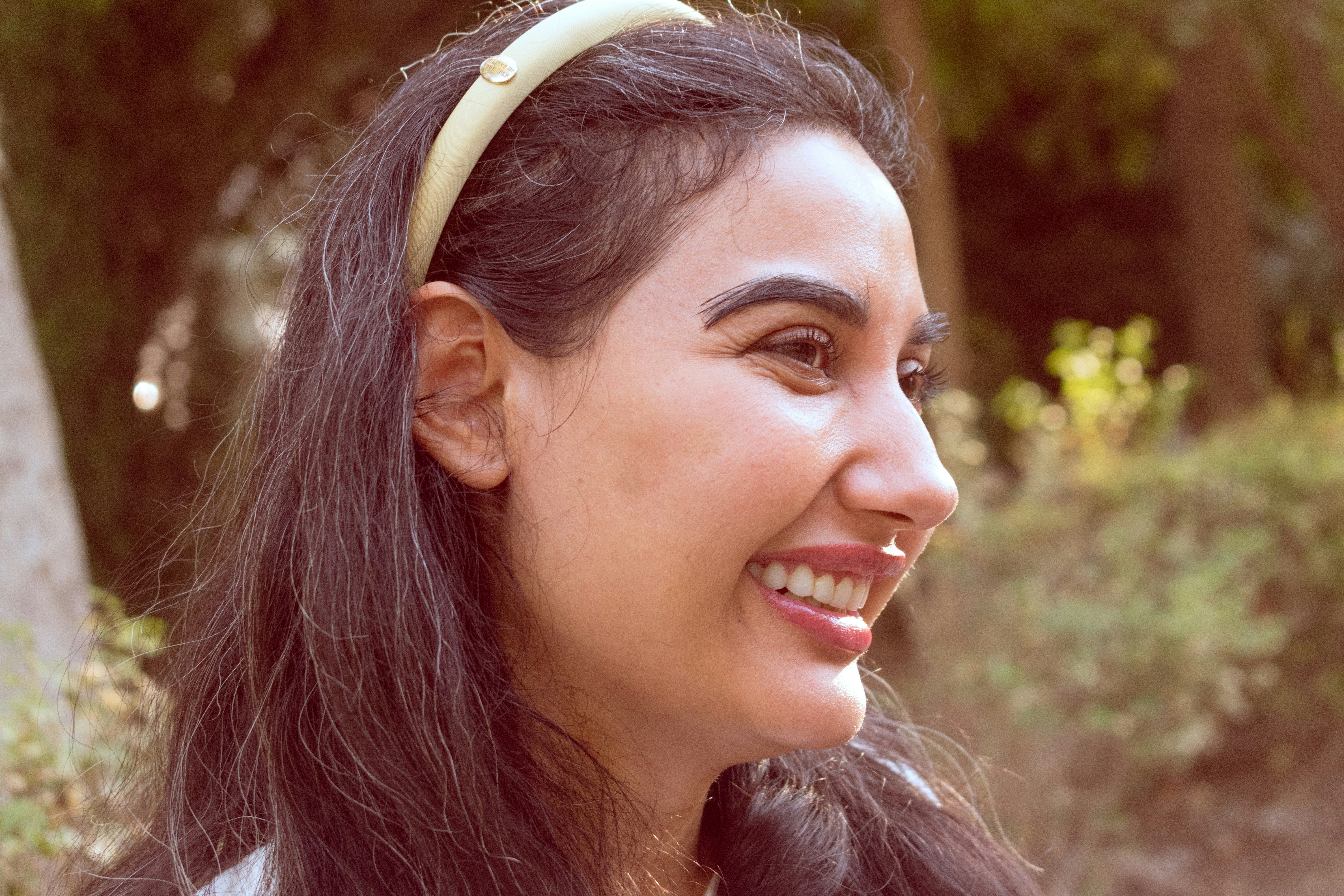 Sunlit Smile: A Portrait in Warm Outdoor Light