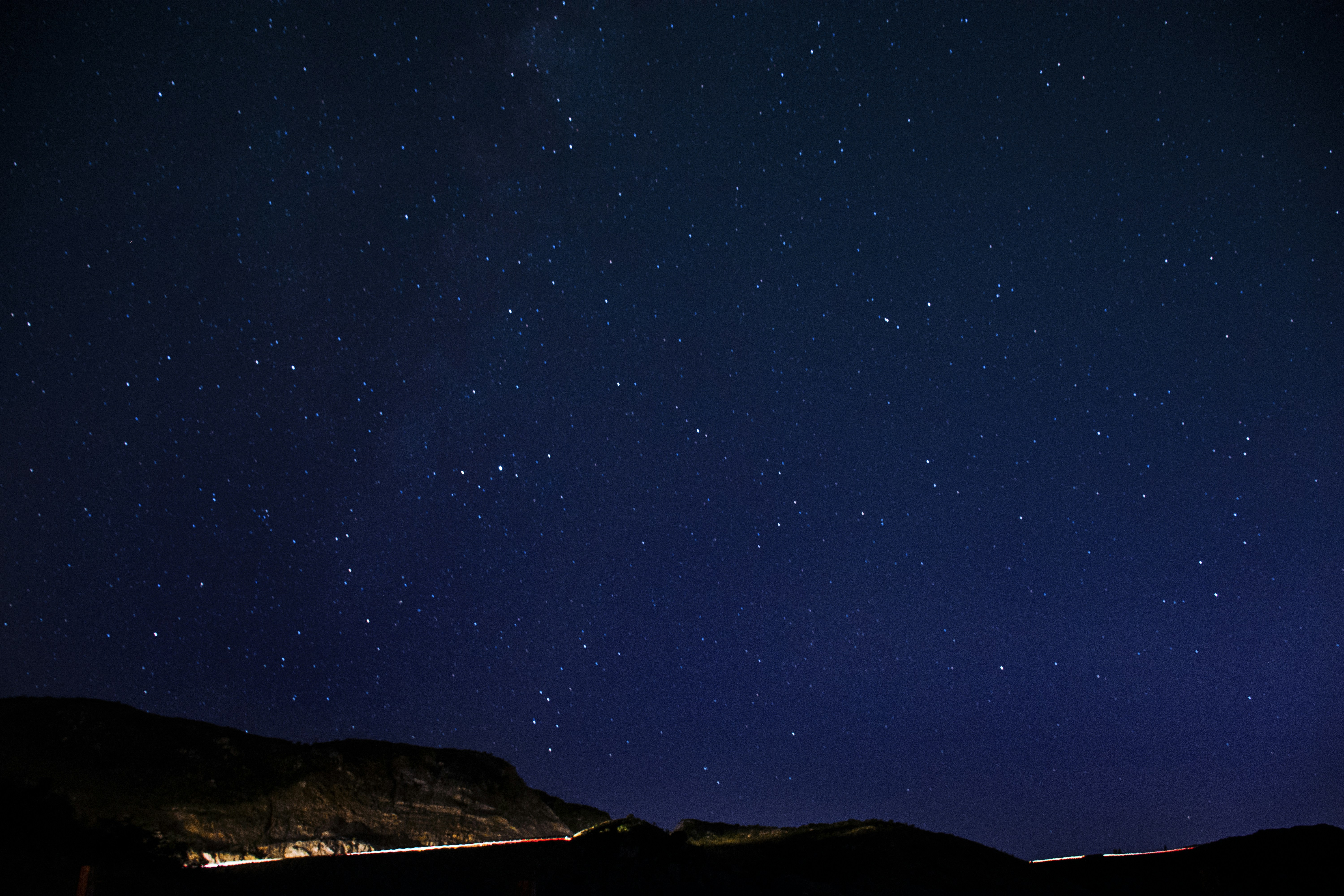 Night Sky Over Silent Hills: A Quiet Distant Milky Way Glow