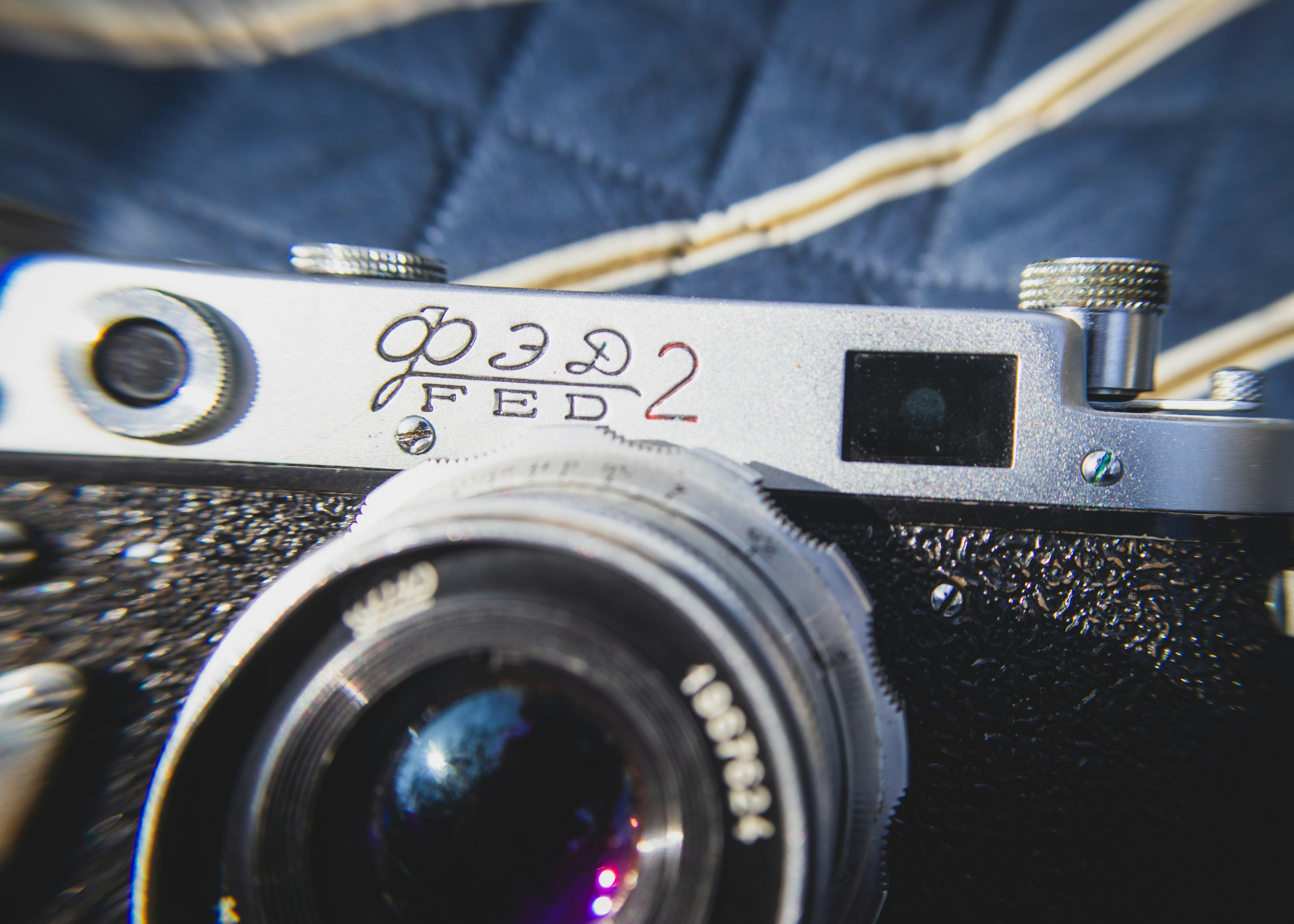 Slim vintage rangefinder with engraved FED logo and exposed lens jar