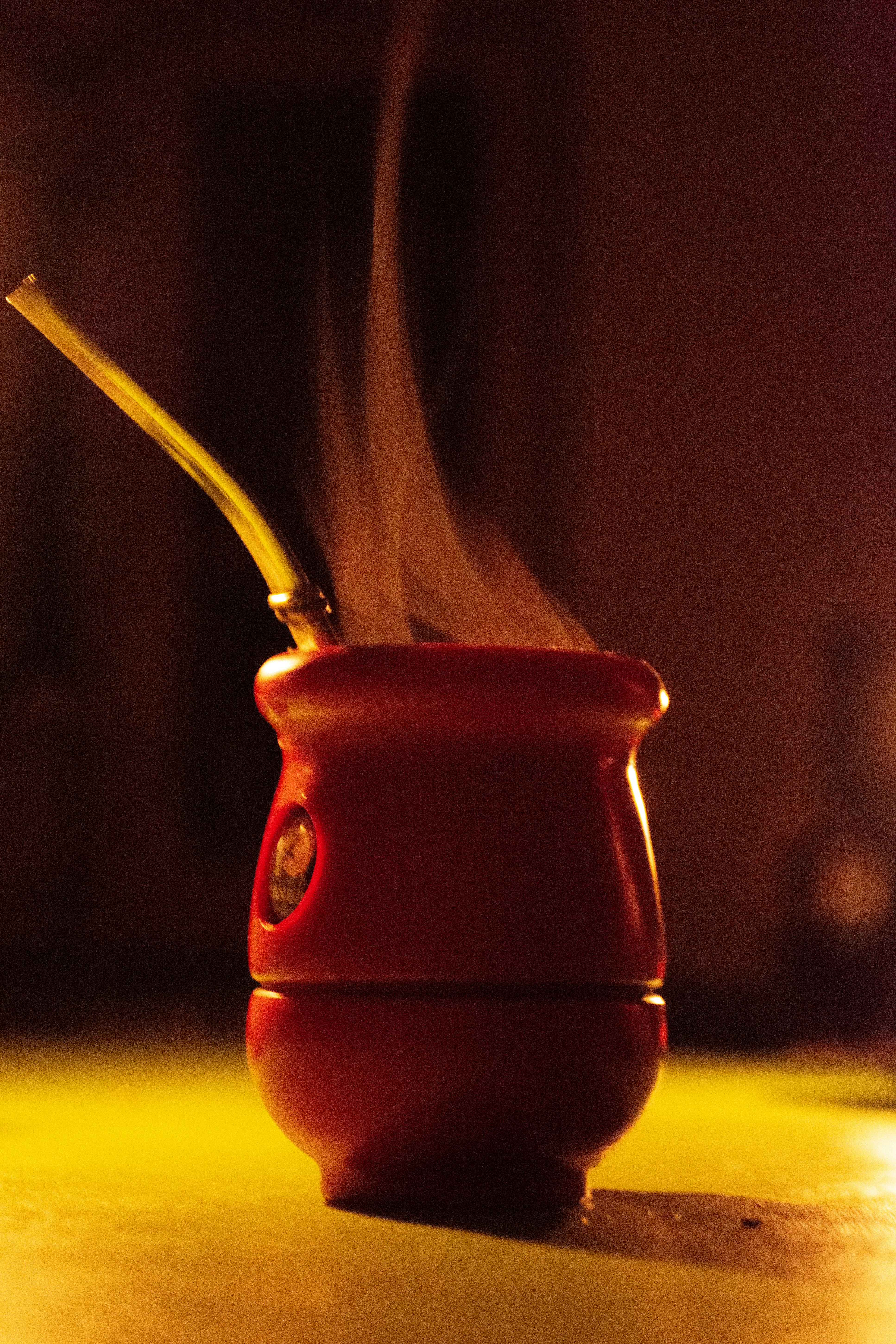 Candlelit Kazán: A single red hookah vessel in an intimate glow