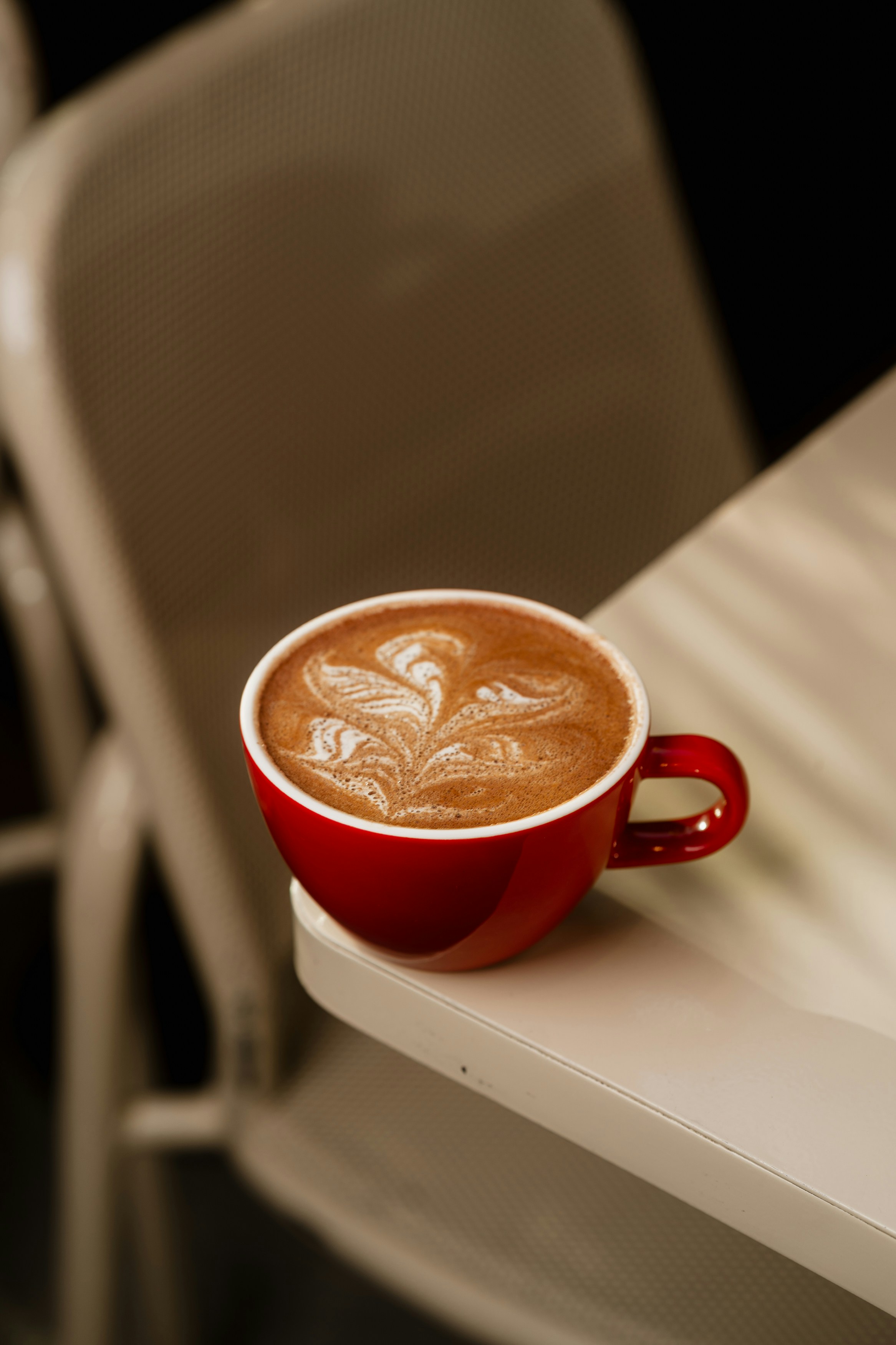 Red Cup on a Creamy Canvas