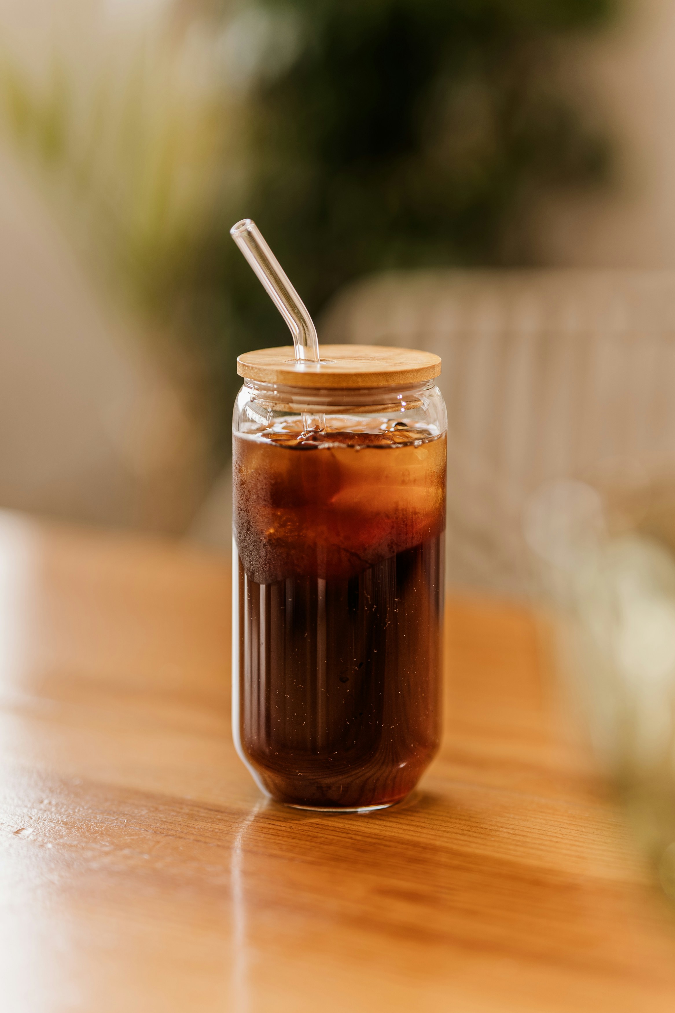 Glass Jar Iced Coffee on a Sunlit Wooden Table