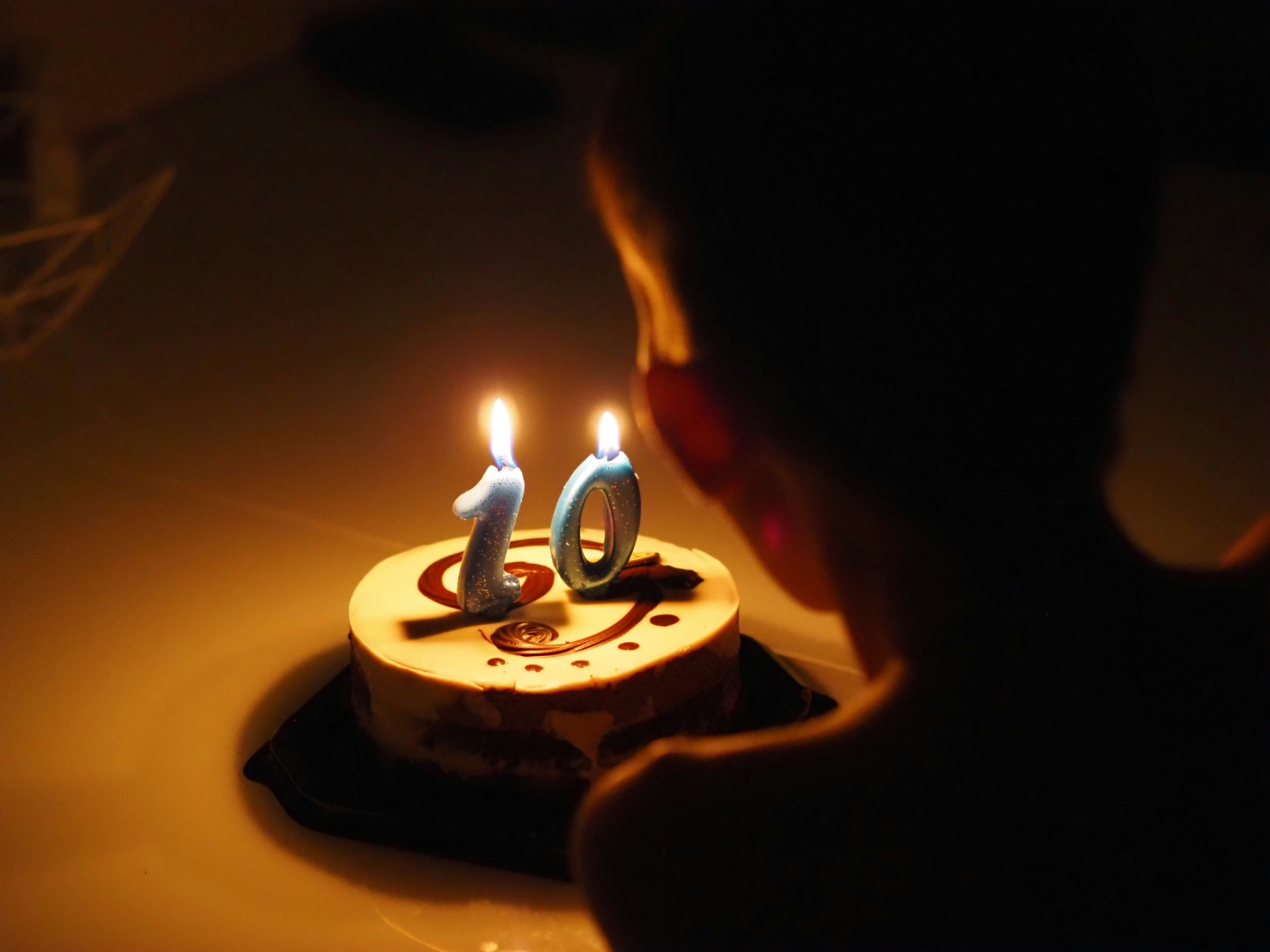 Candlelit Birthday Moment: A Silent Wish by the Cake