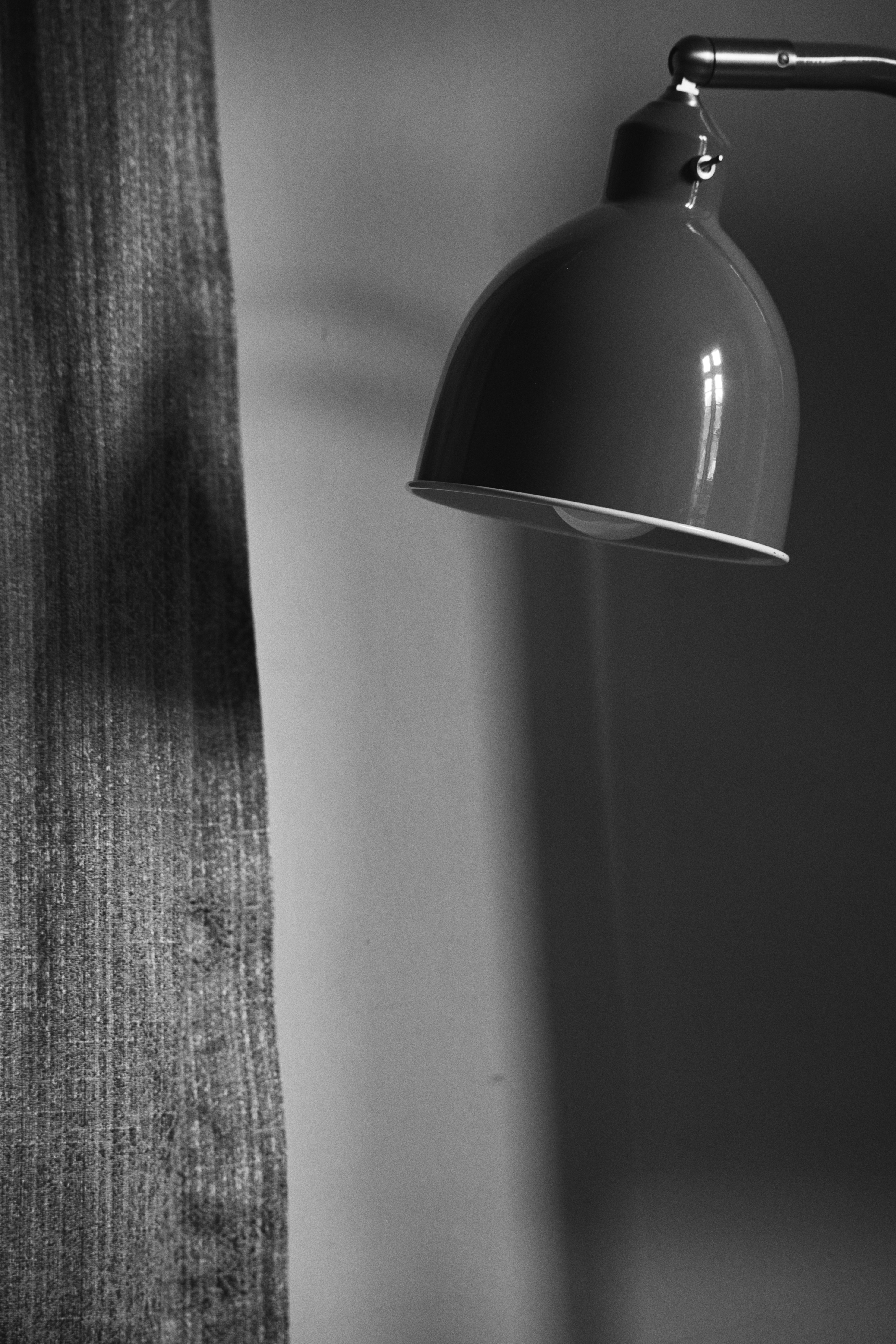 Illuminated Cone: A Close-Up of a Desk Lamp in Mono