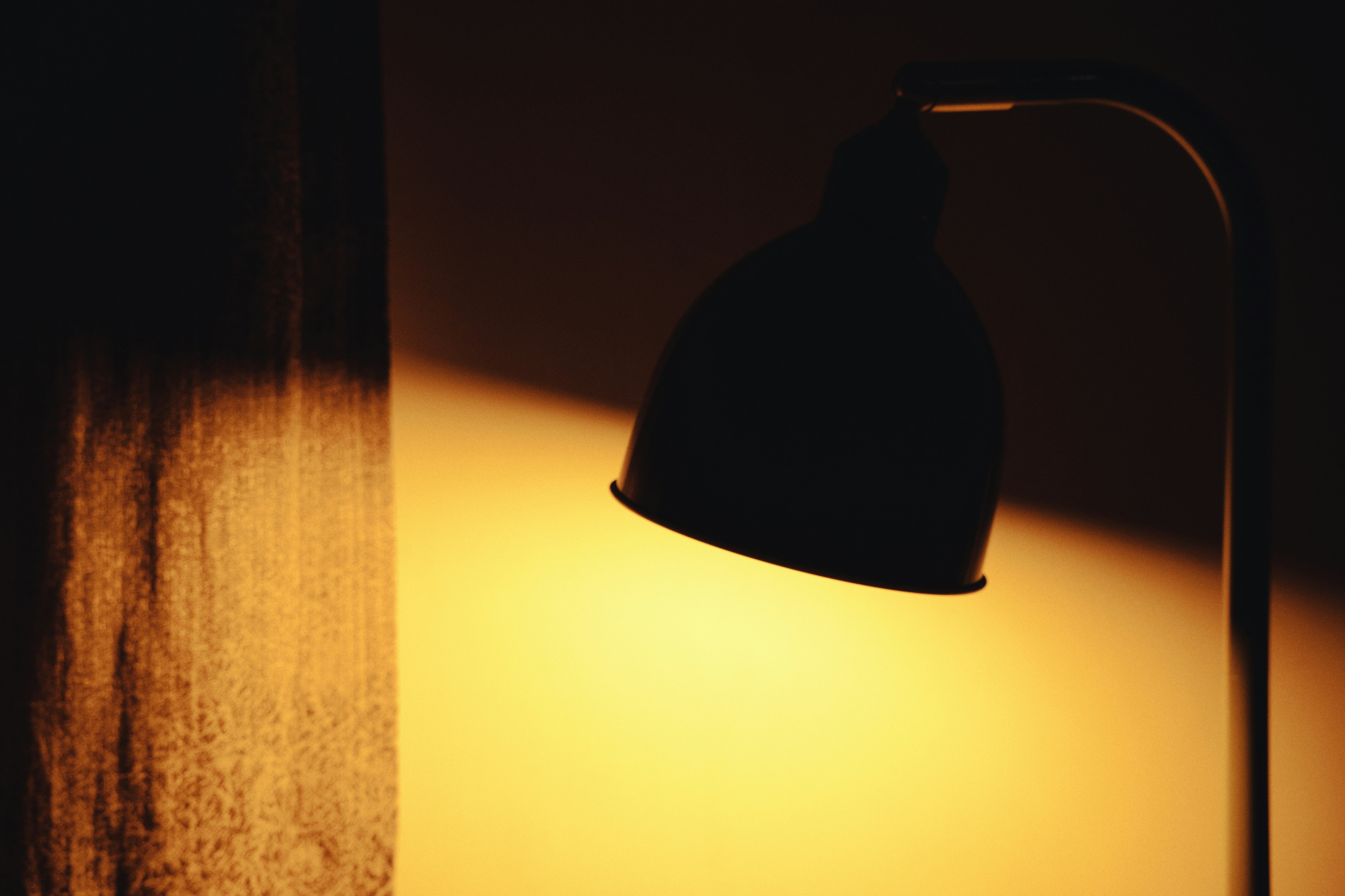 Warm Isolation: A Desk Lamp Casts a Quiet Glow