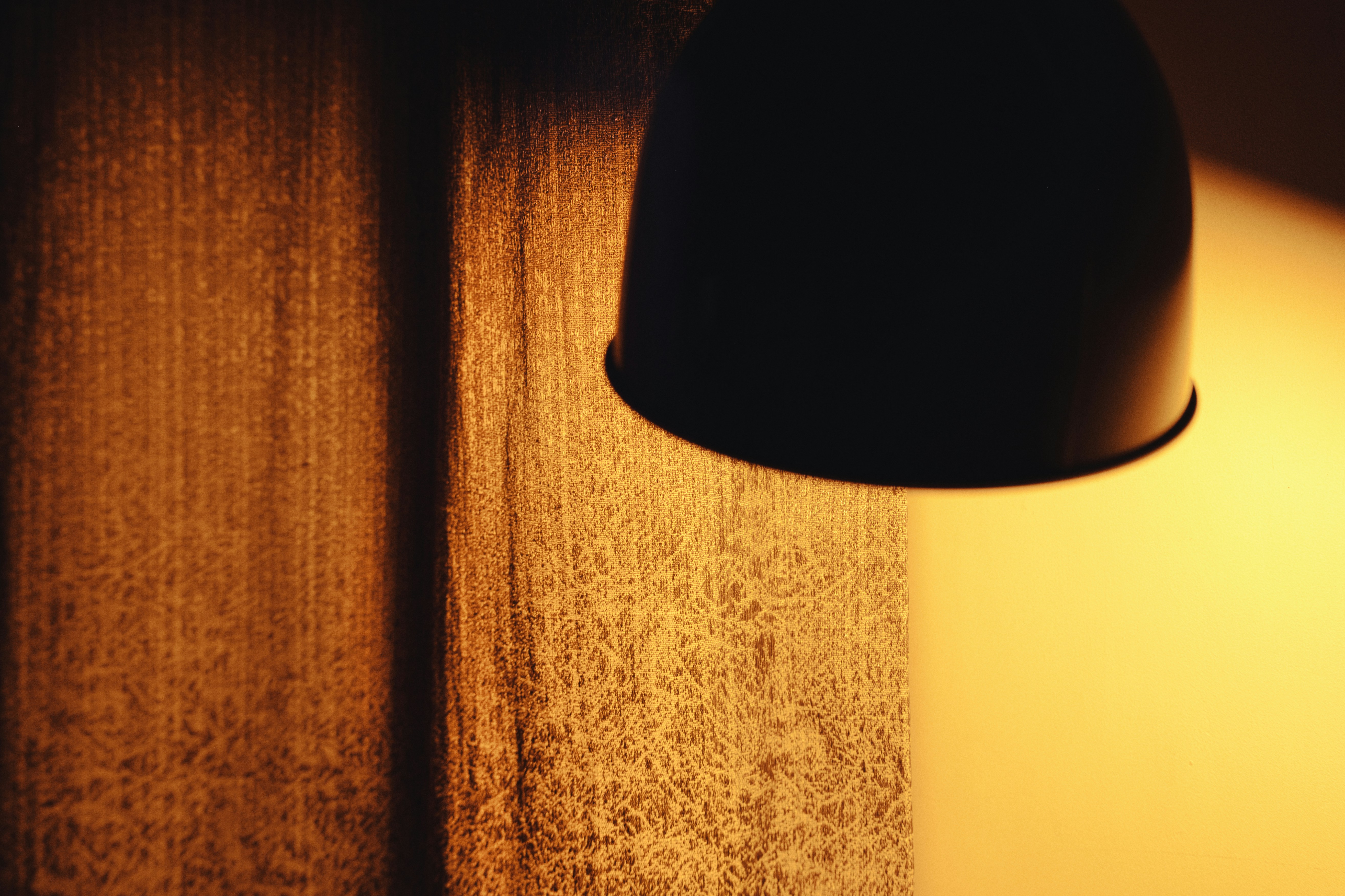 Luminous Capsule: A Minimalist Lamp Cast in Golden Shadow