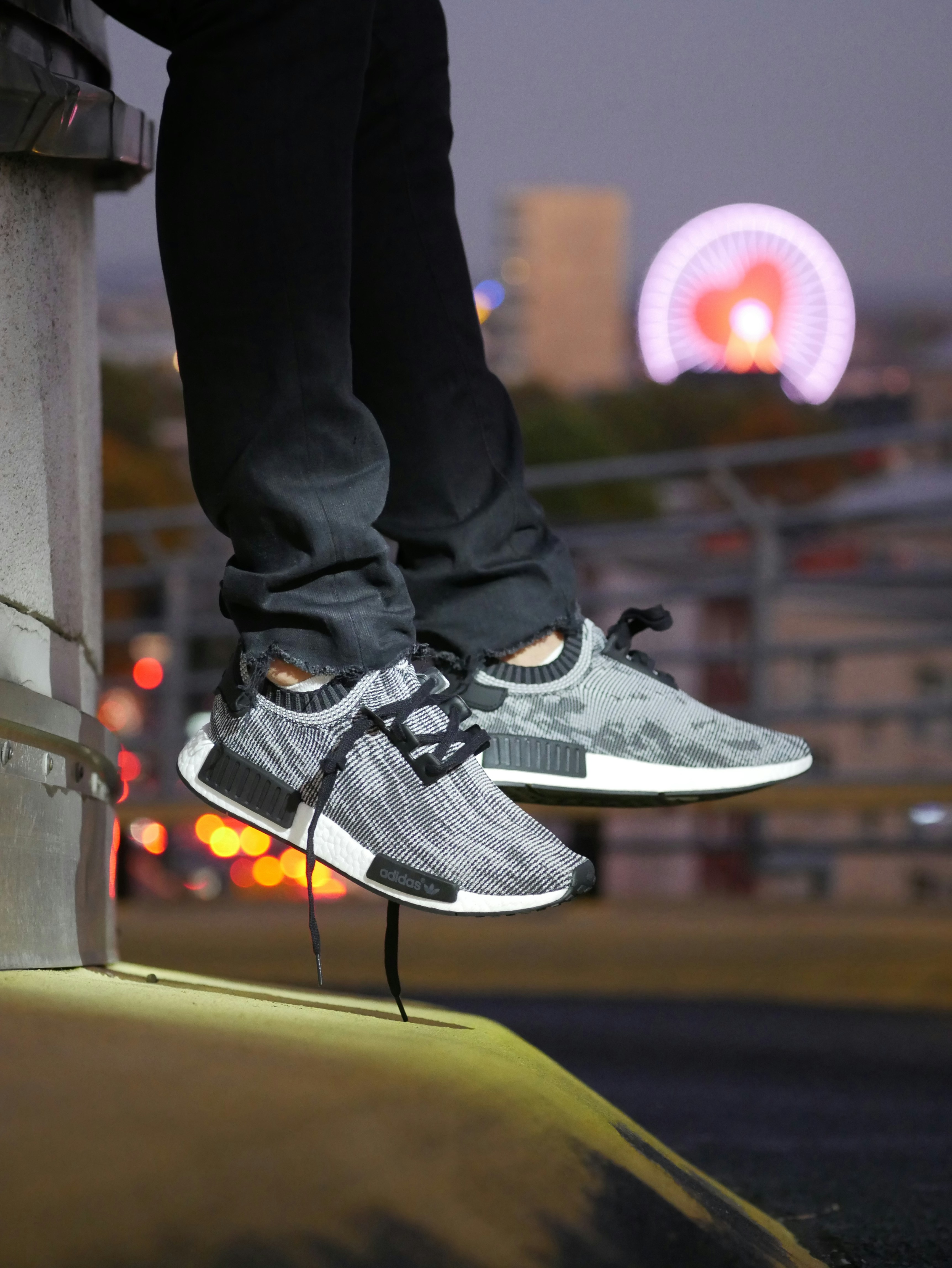Levitating Sneakers Over the Rooftop Edge