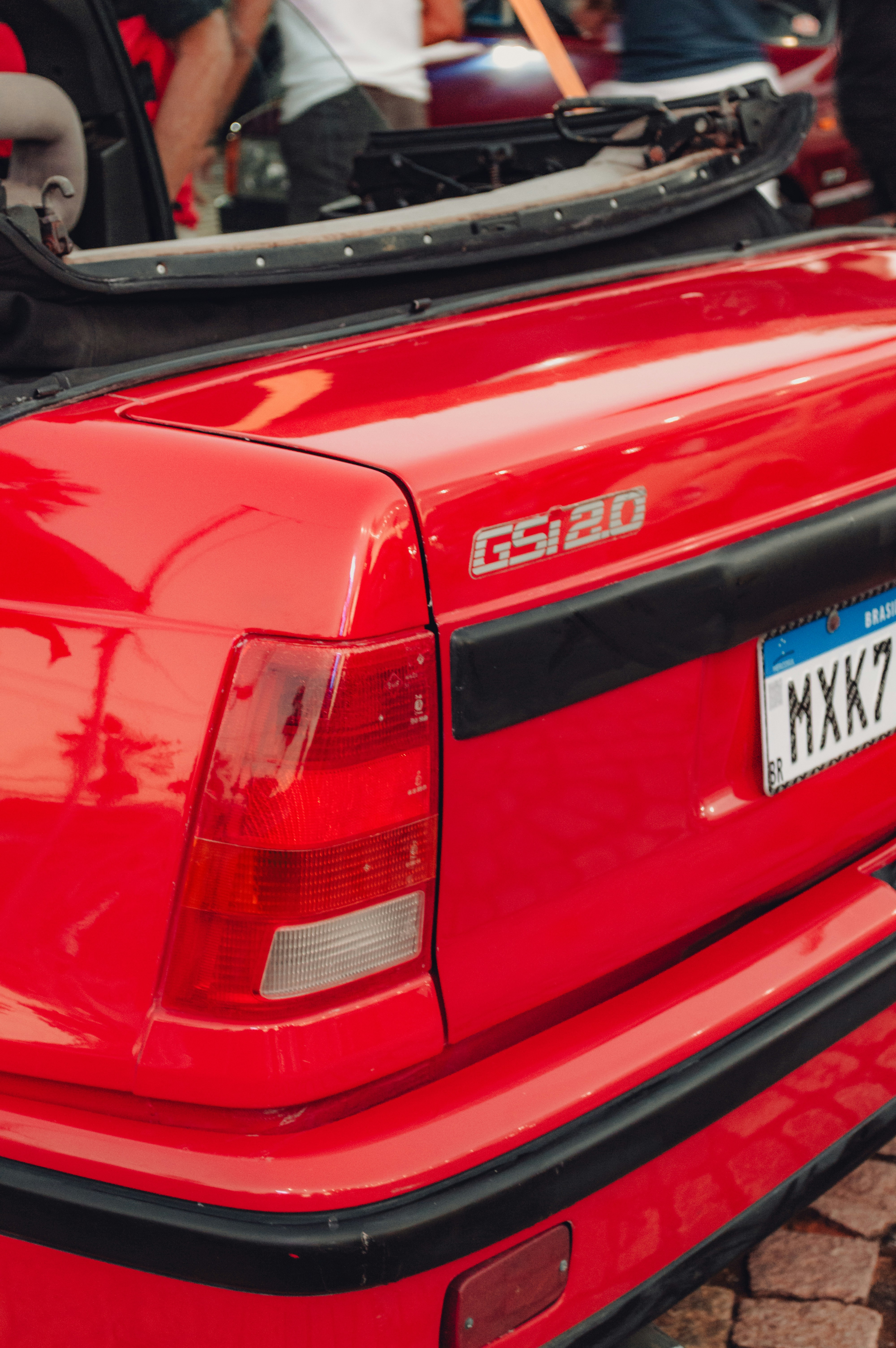 Red Thunderbird: The GSI-120 badge on the trunk of a classic fire-engine red car