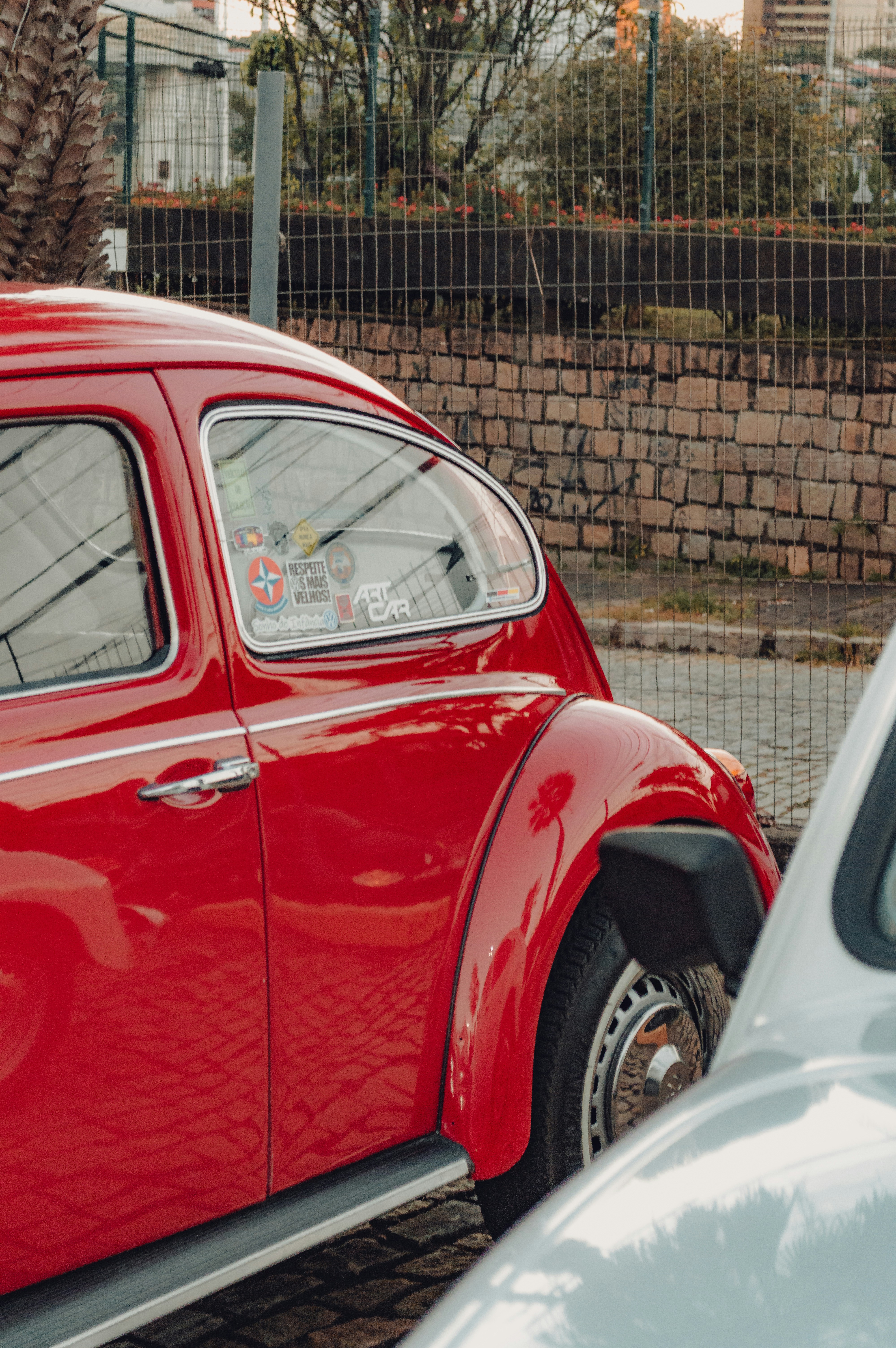 Red Classic: A Vintage Volkswagen Cornered by Soft Street Light
