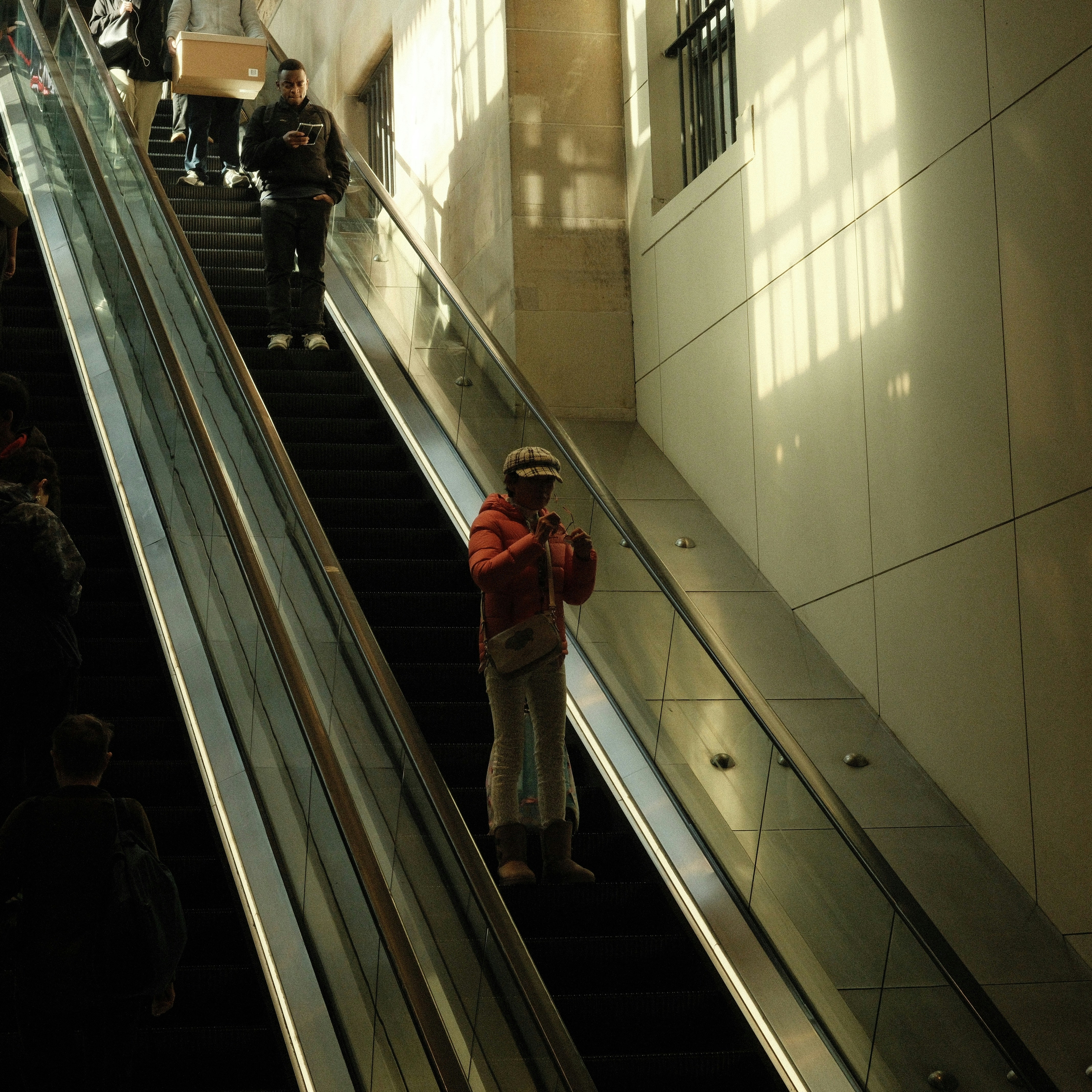 Escalator Portrait: A Curious Moment in the Atrium