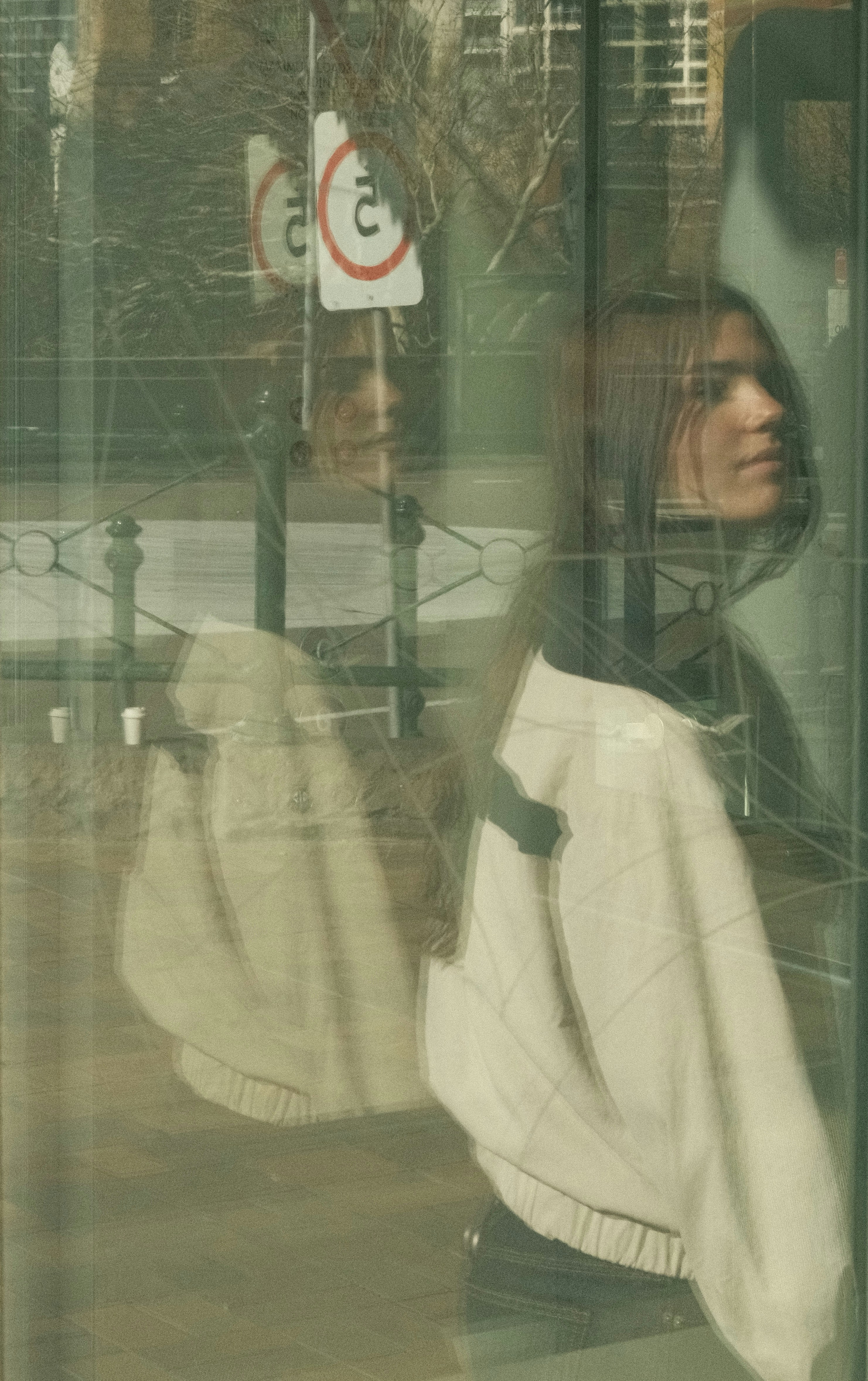 Reflections in Glass: A Quiet Portrait Behind the Pane
