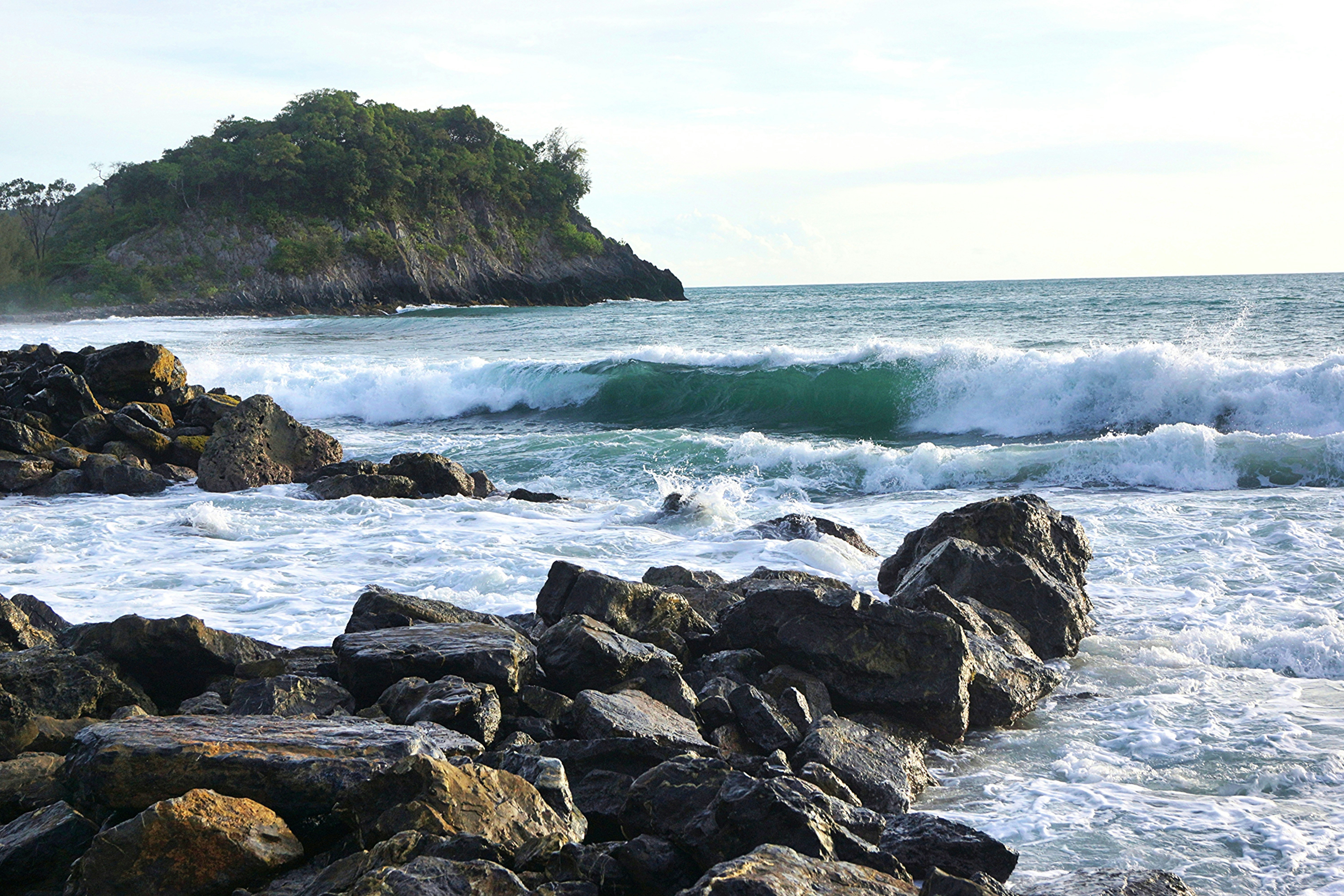 Rocky Breakers and Emerald Crest: Coastline at Dusk