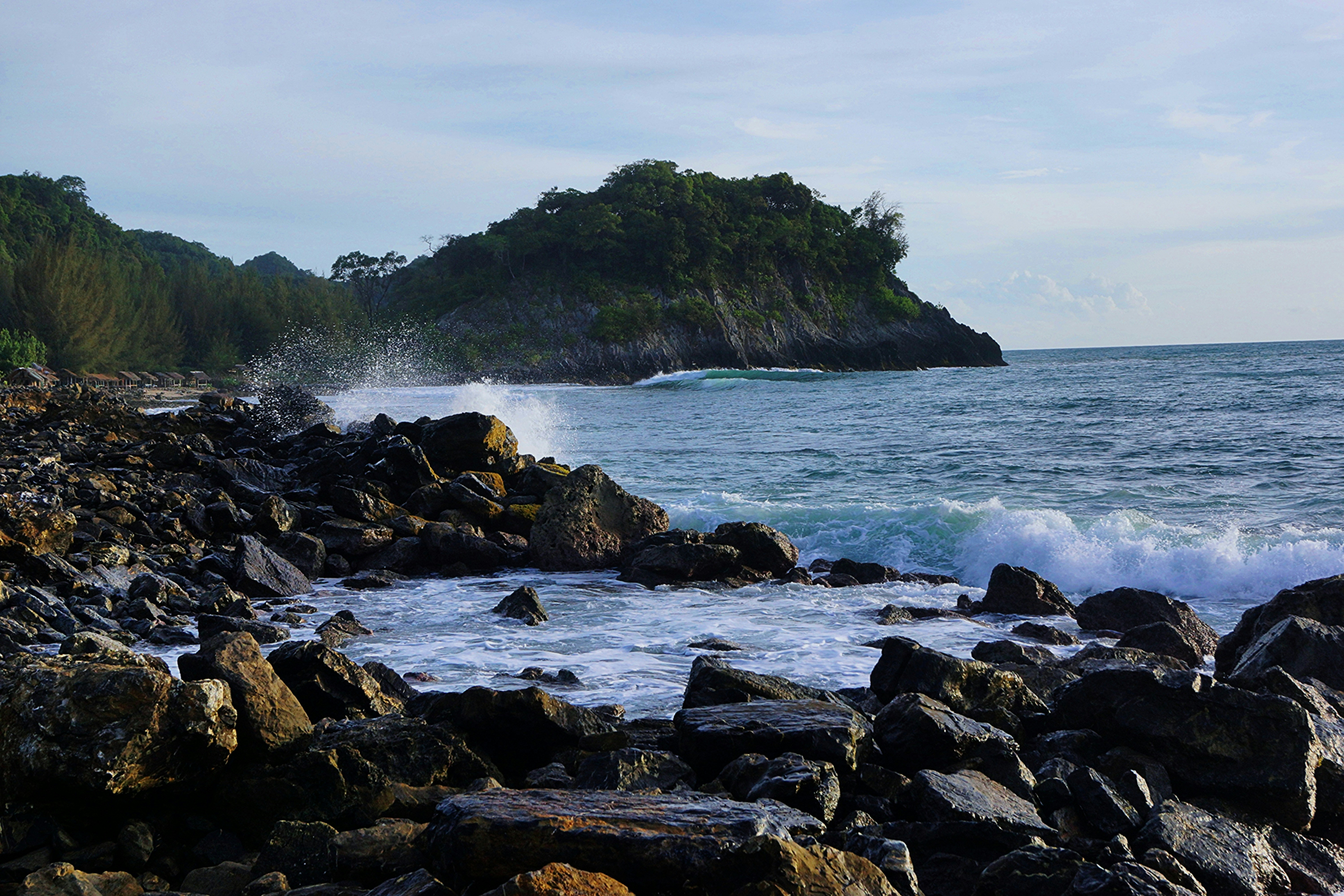 Storm-softened Cove: Jagged Lava Rocks Meet the Quiet Sea