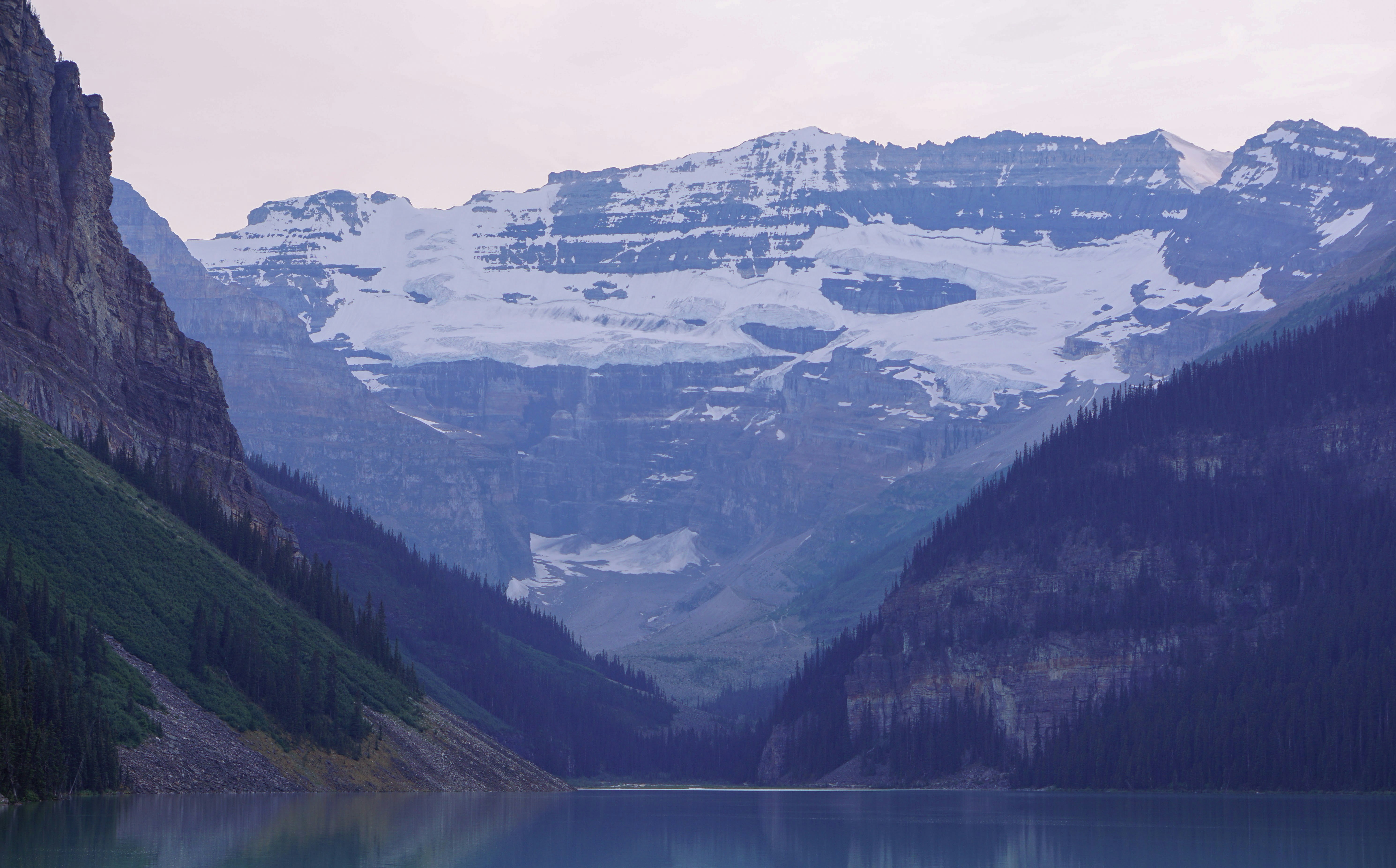 Glacial Veil over a Serene Alpine Basin