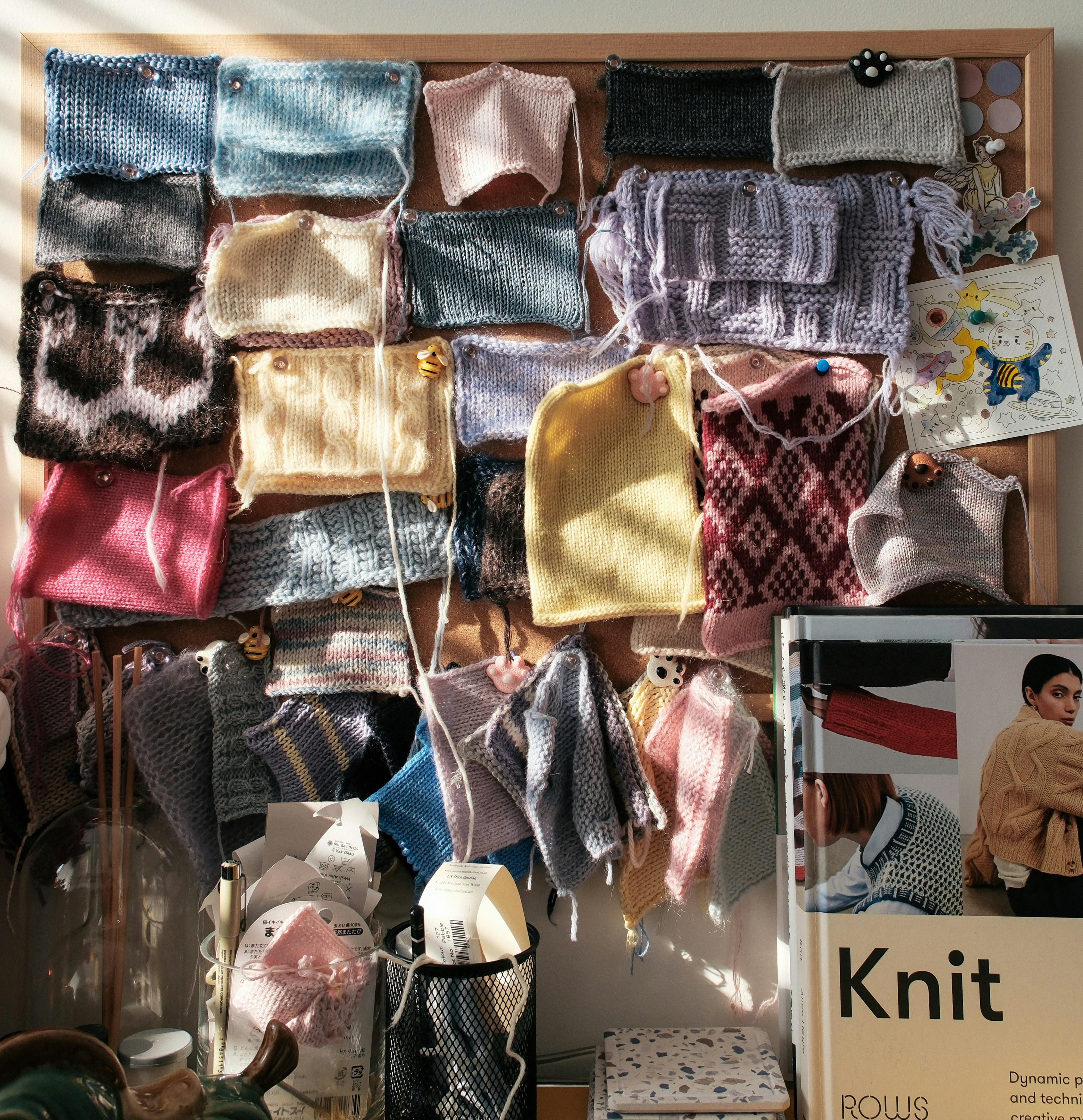 Knit Gallery: a colorful wall of handmade swatches and a knitting-themed display