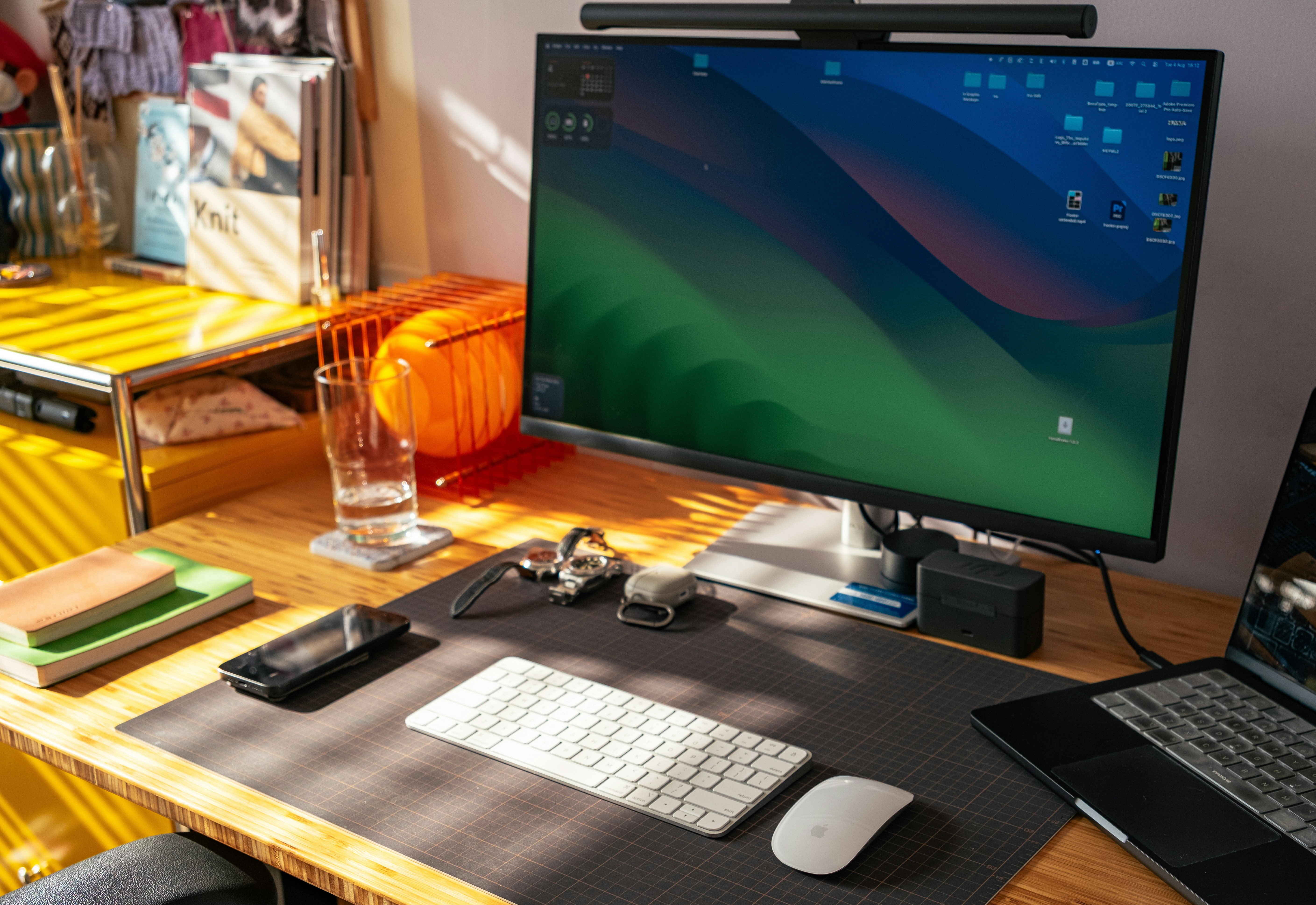 Neat Tech Nook: A Mac and Monitor Command Center on a Sunlit Desk