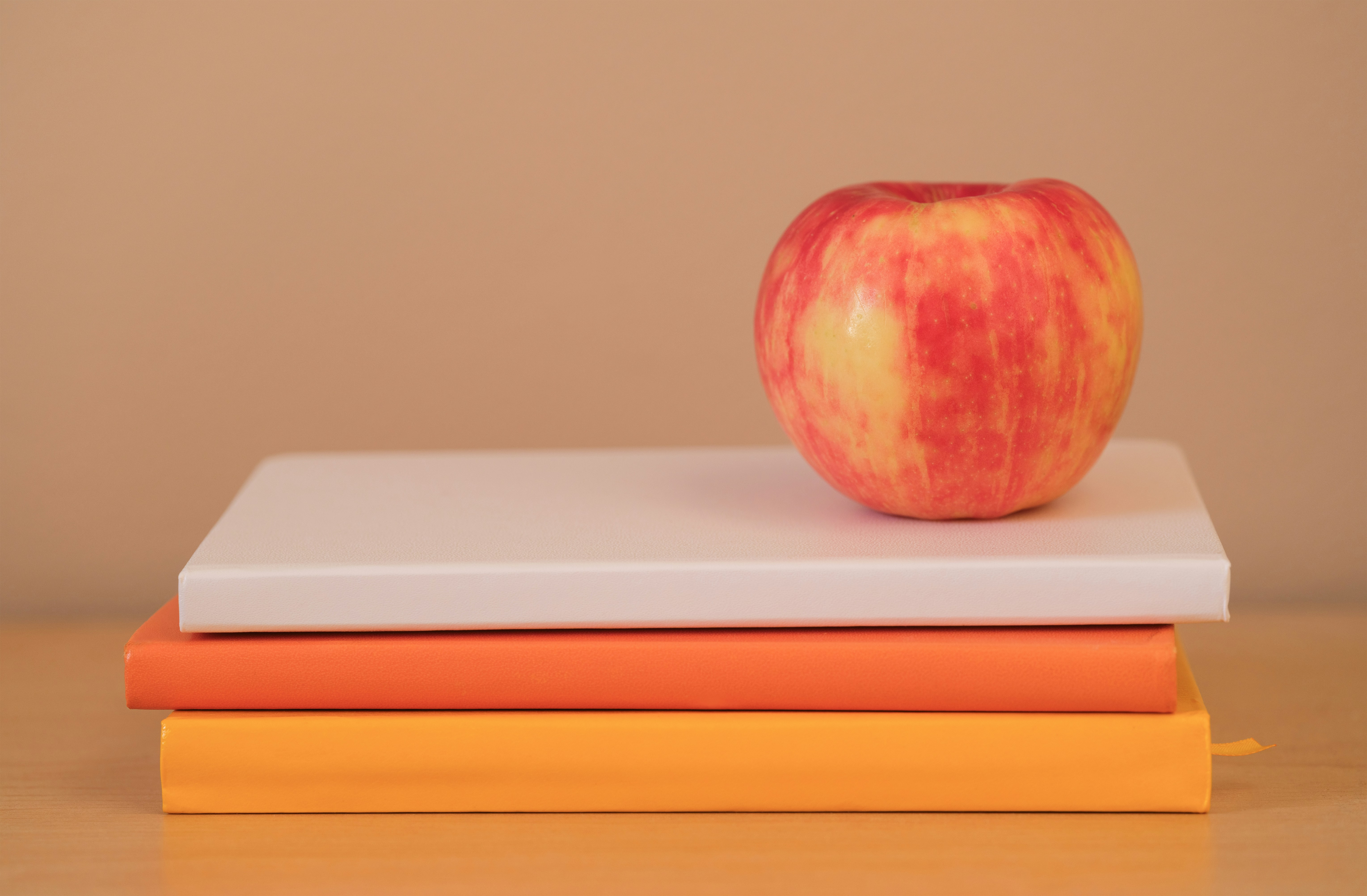 Apple on a Stack: Quiet Geometry of Books and Fruit