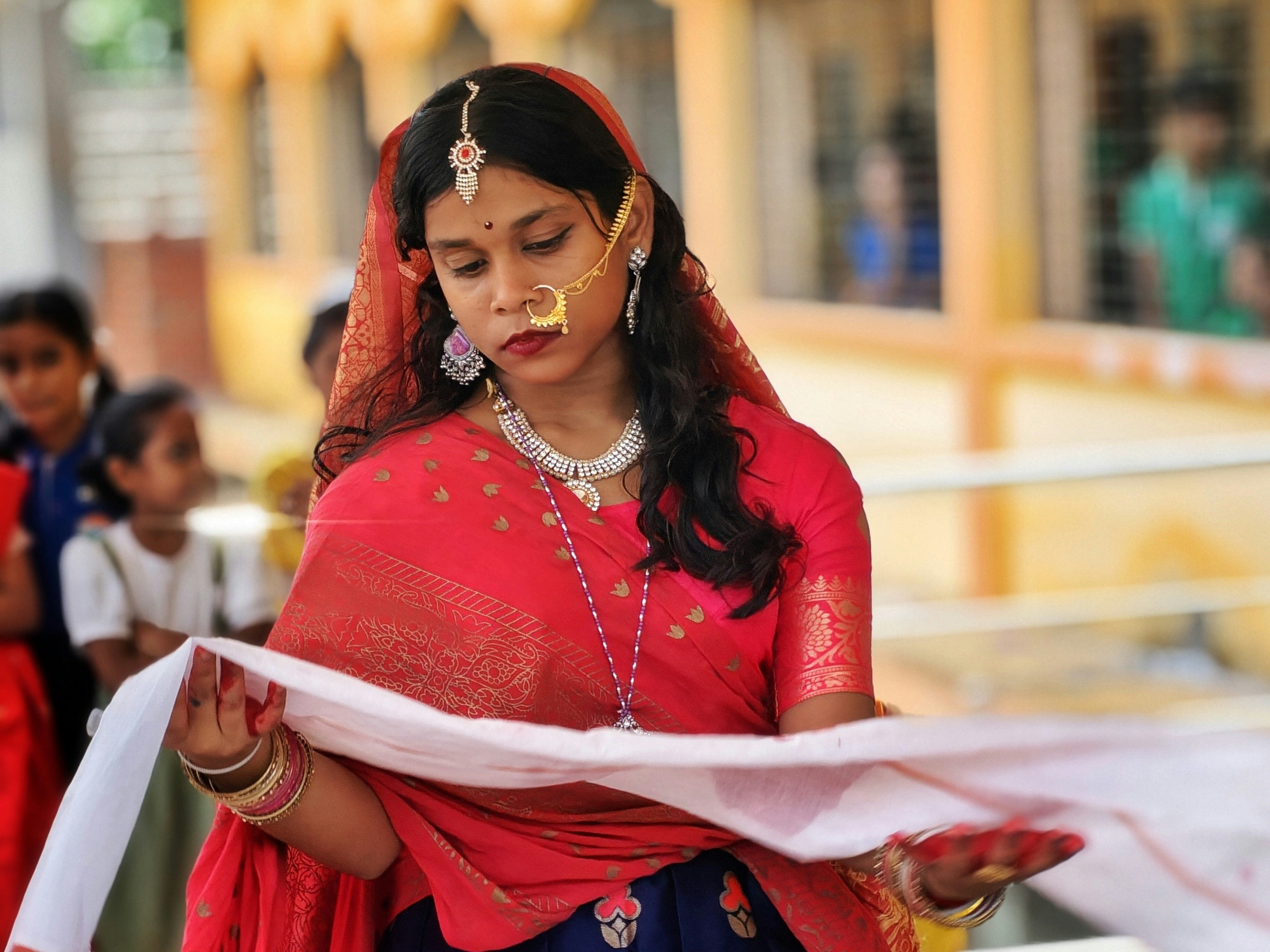 Red Saree Quiet Moment: Classic Adornments in the Midday Splash of Color