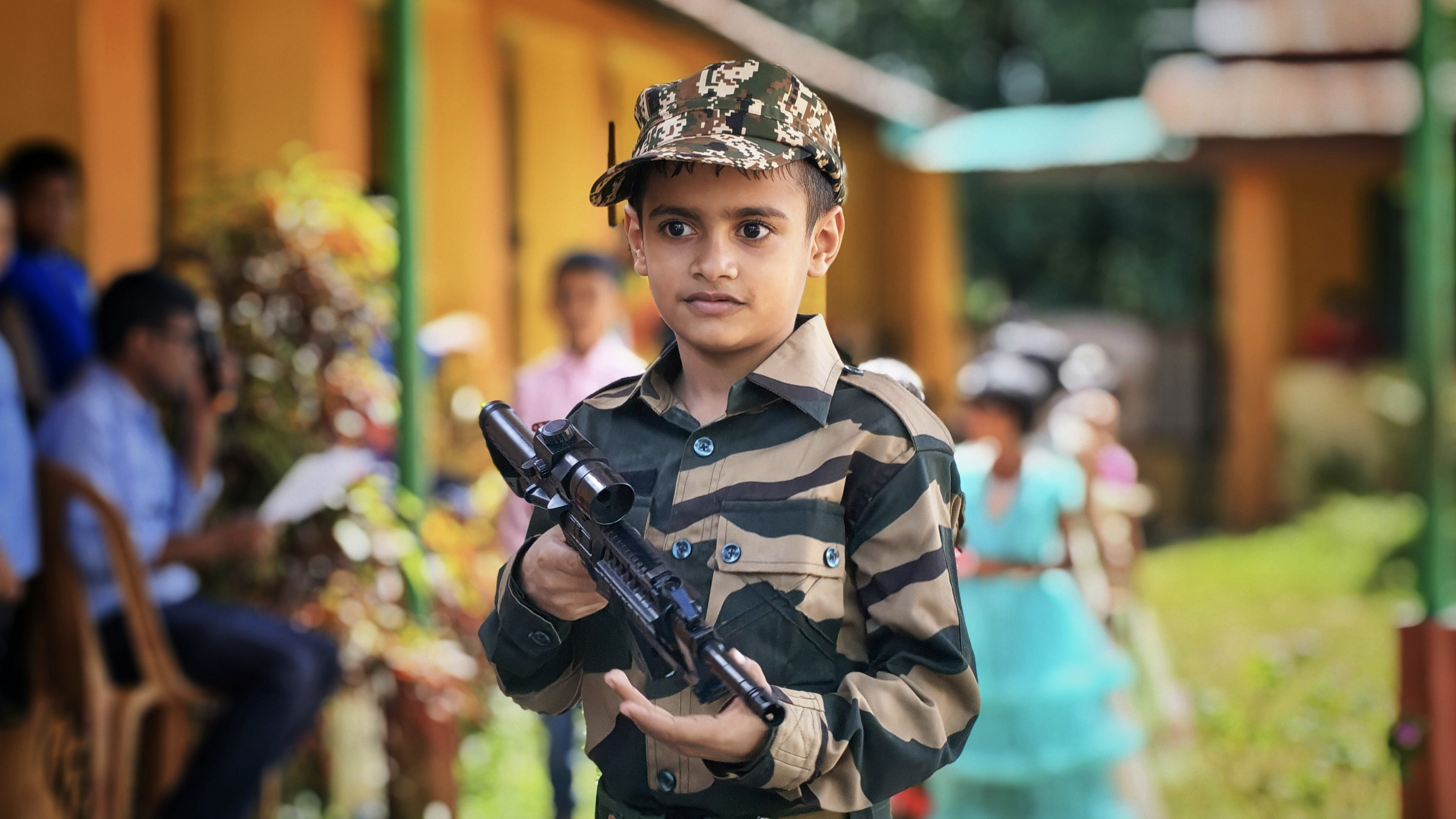 Young Recruit in Camouflage: A Bold Stare with a Rifle