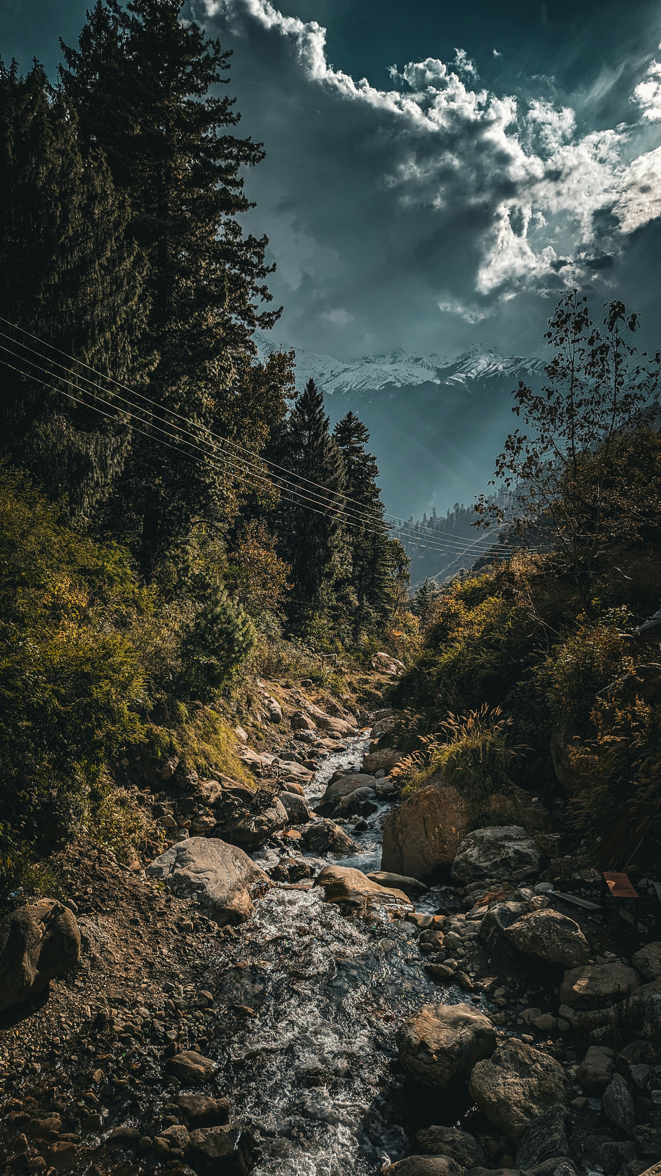 Rugged Mountain Stream under a Dramatic Sky