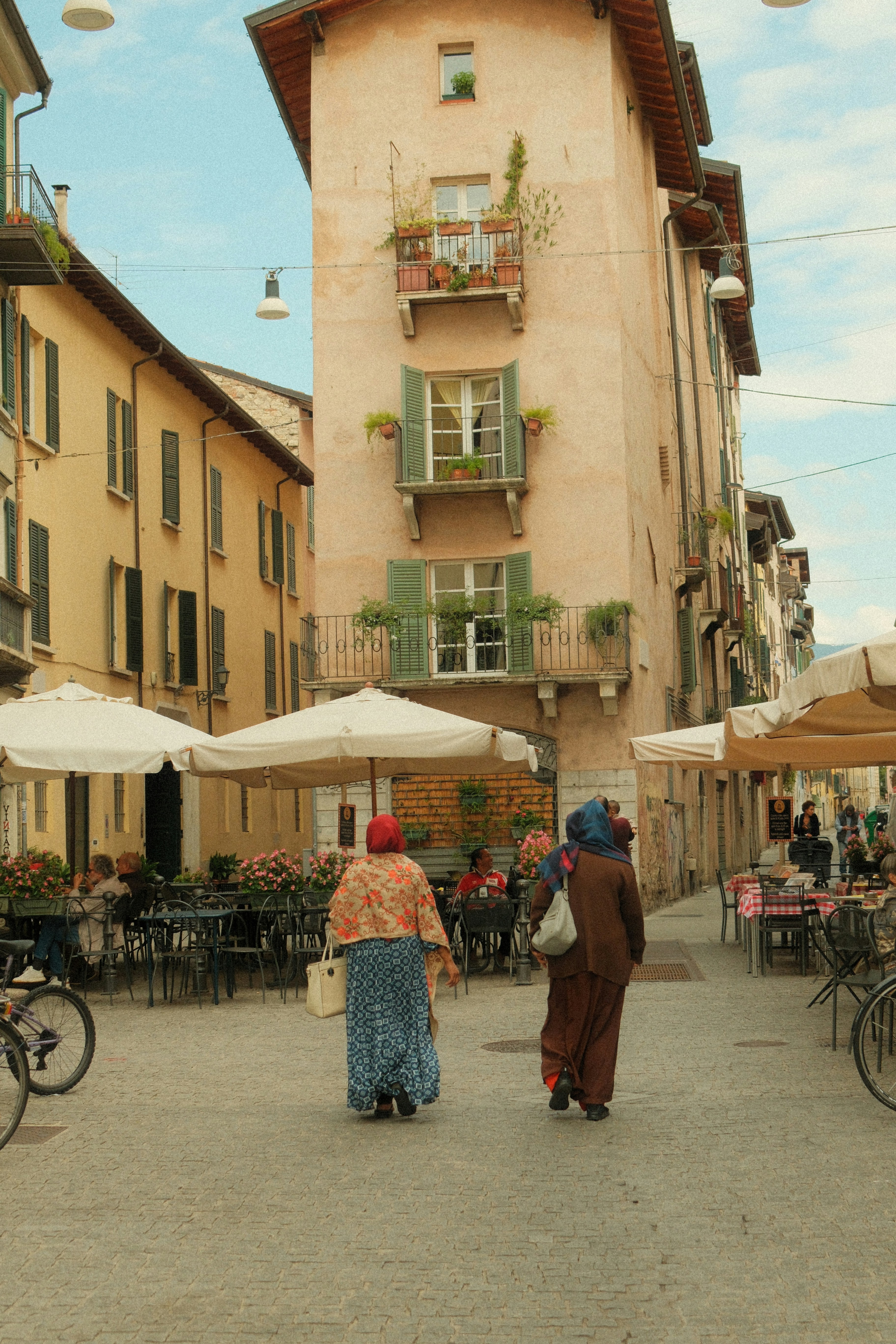Cobbled Piazza Rendezvous beneath Autumn Awnings