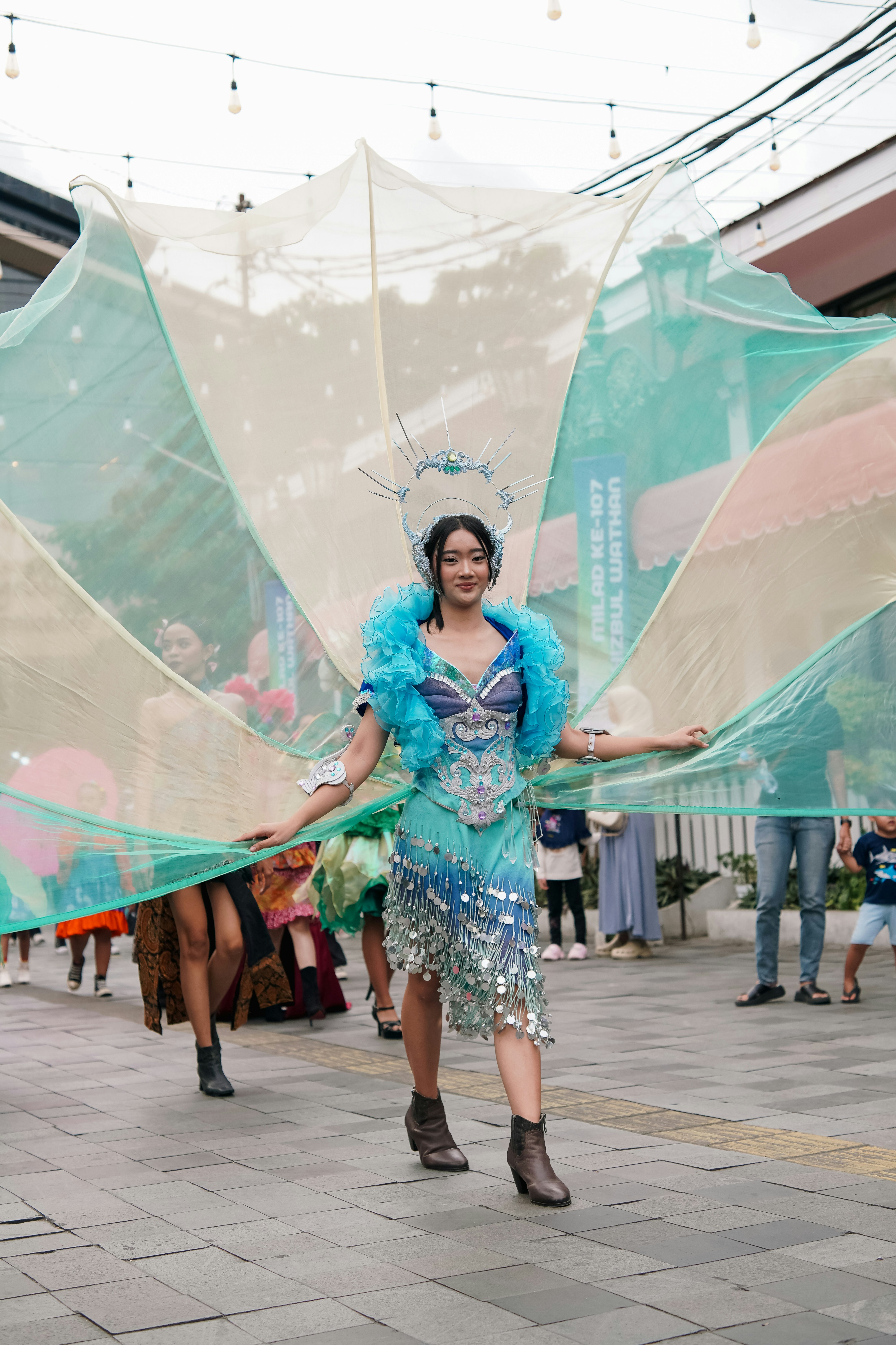 Dance of Turquoise Wings under Market Lights