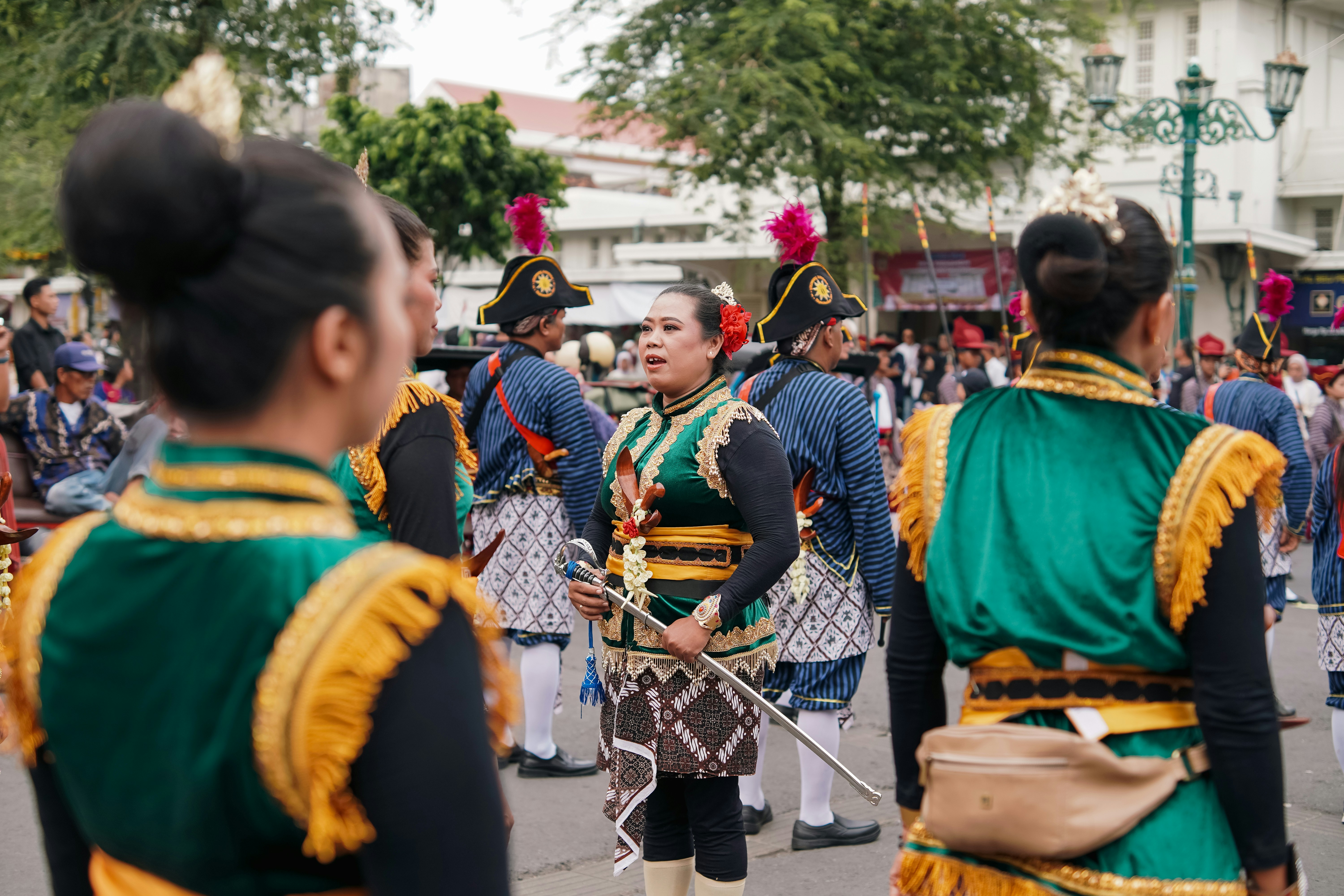 Midway Parade: A Brass-Blue Moment Among Dancers