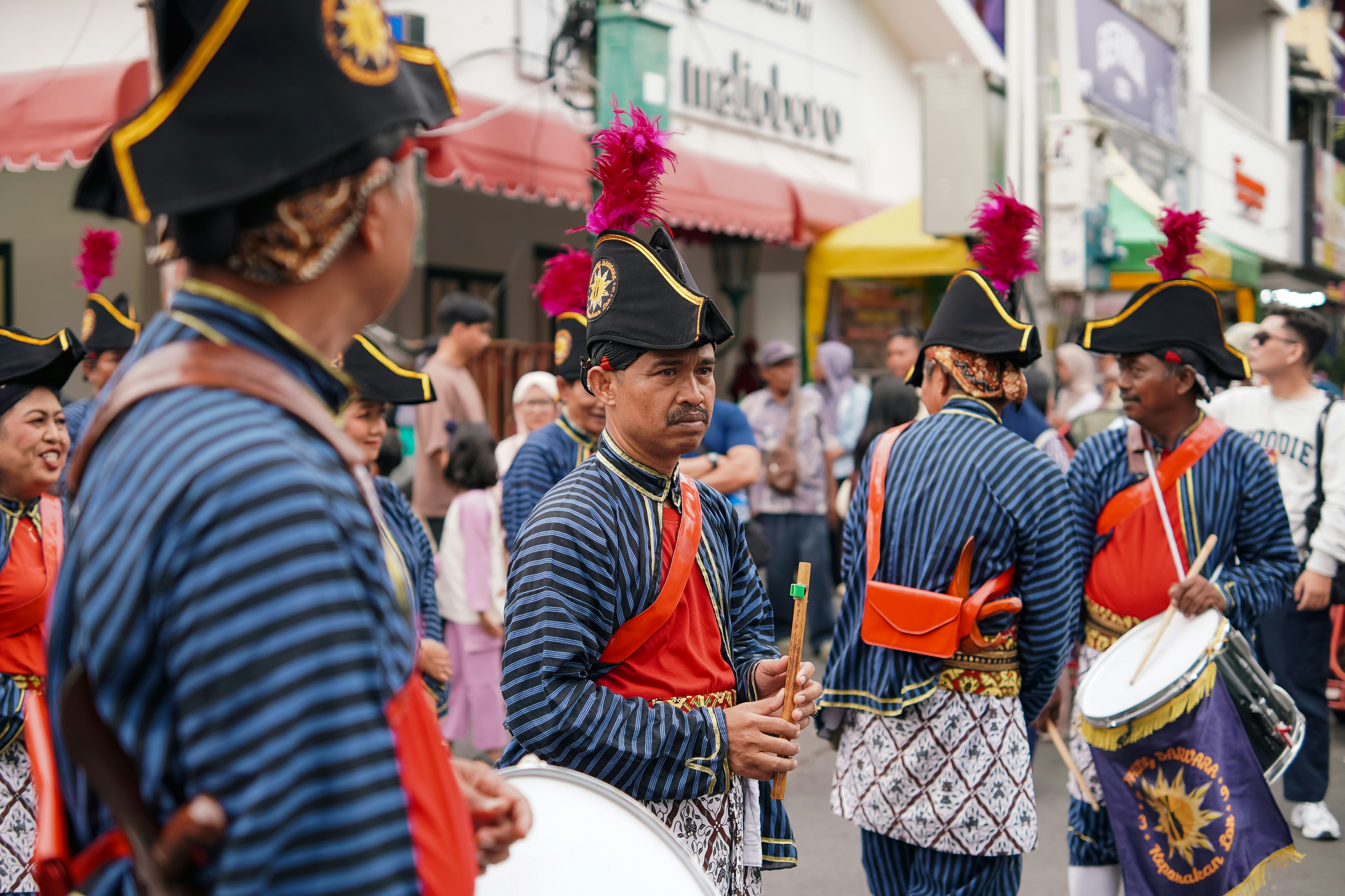 Drummer in the Parade: Colorful Garb and Festival Rhythm on Main Street