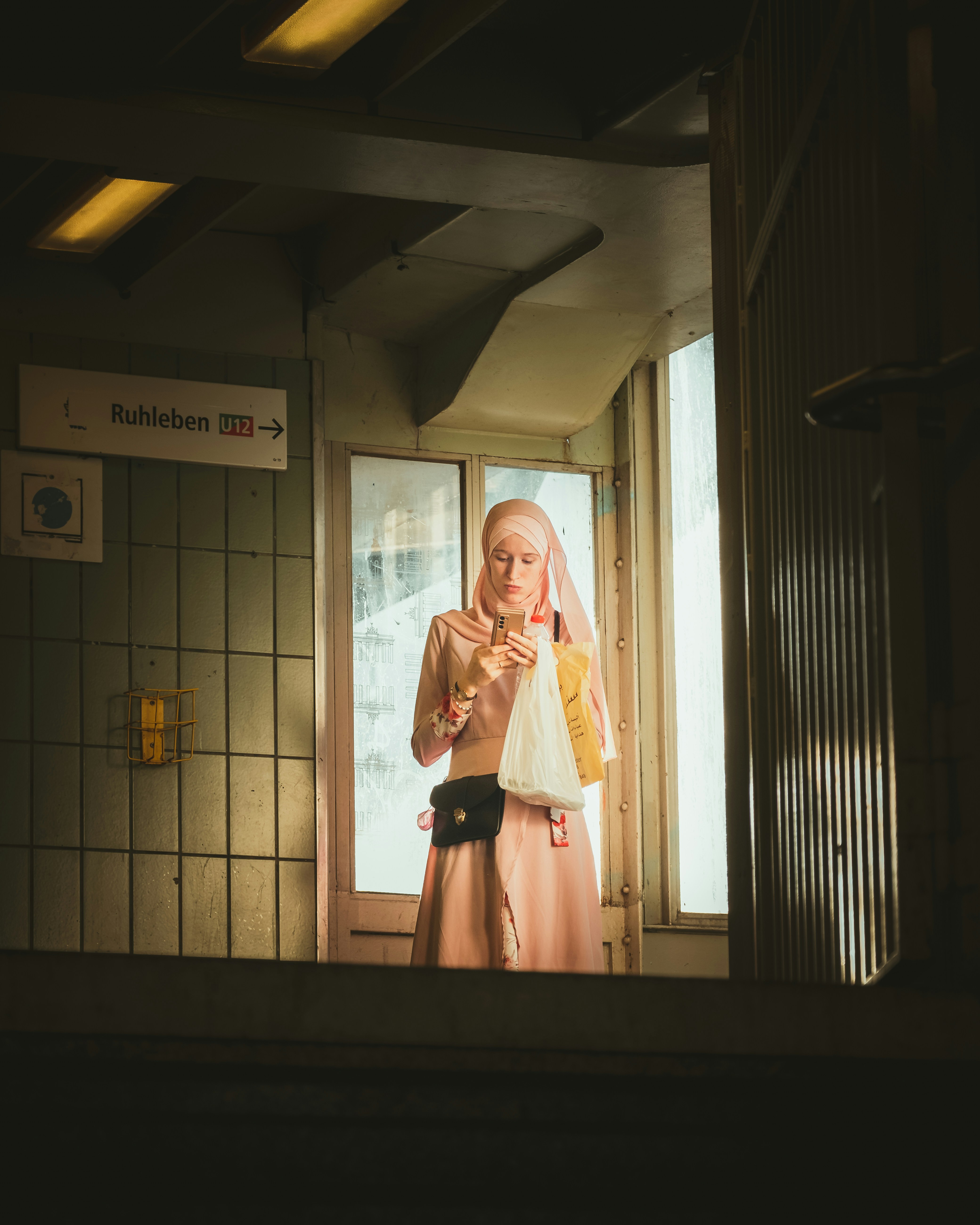Softlylit Hijab in a Quiet Suburban Station