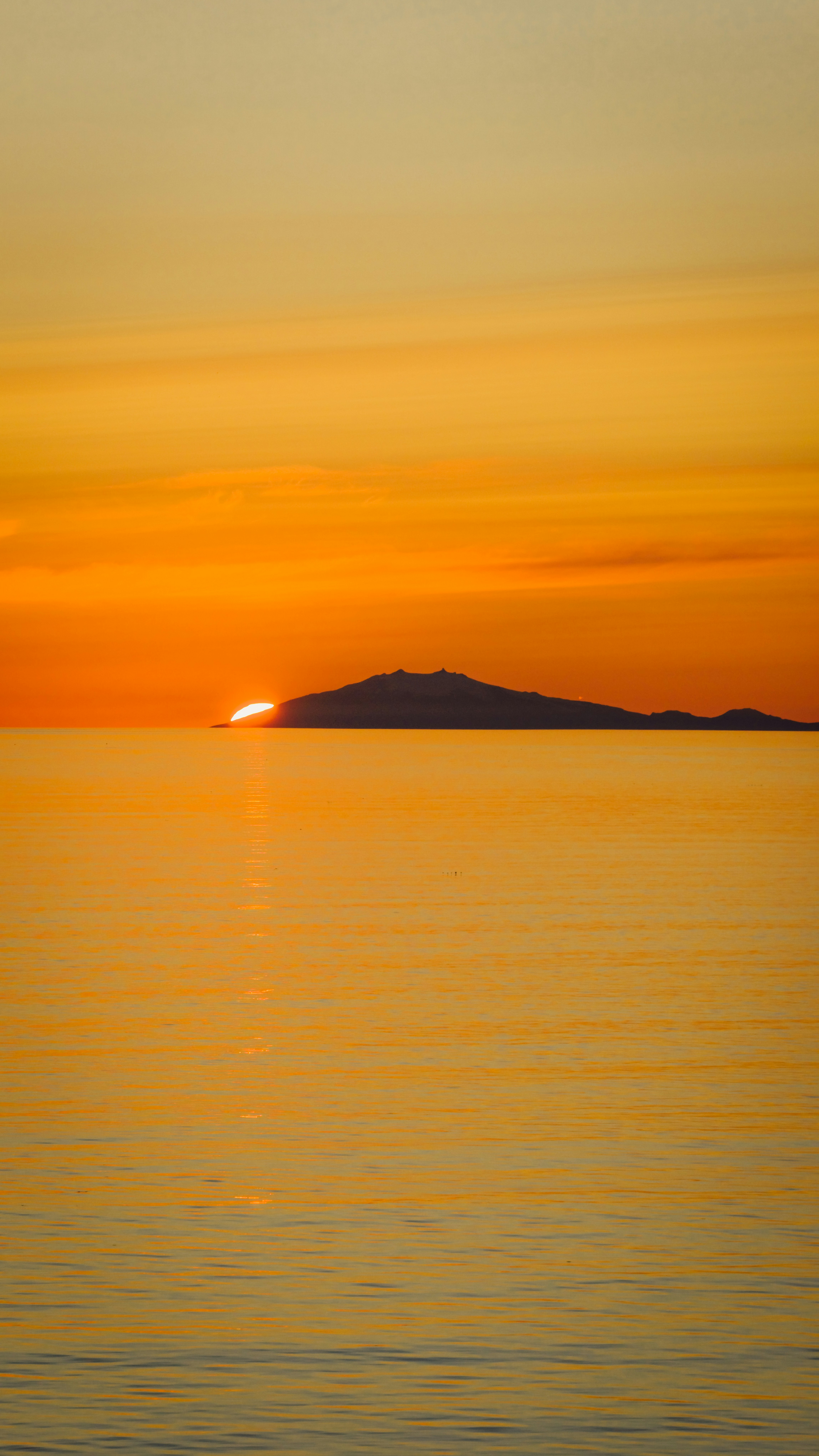 Sunset Edge: A Quiet Horizon Beneath a Fiery Sky