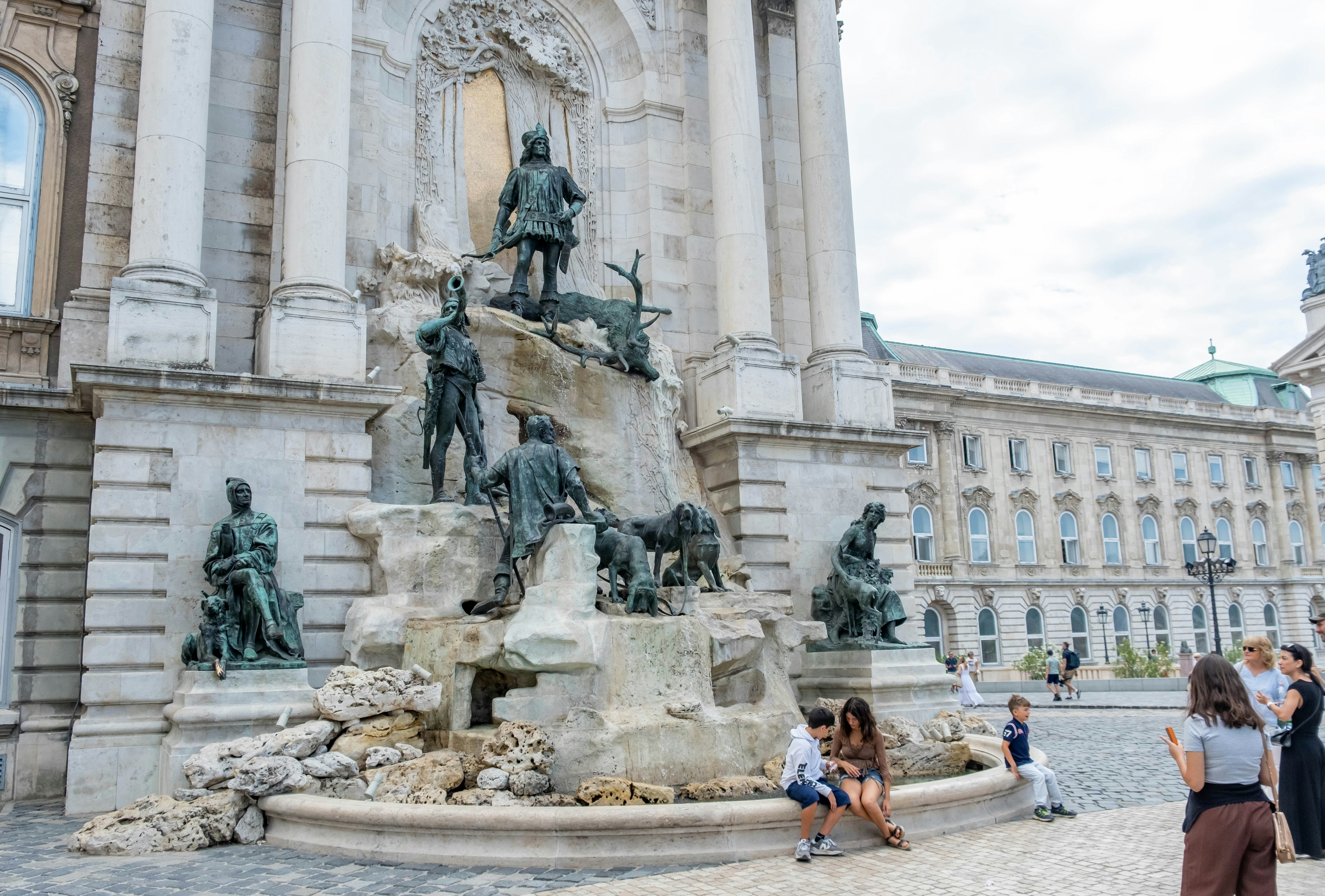 Stone Heroes: Visitors Gracing the Basel Fountain Court