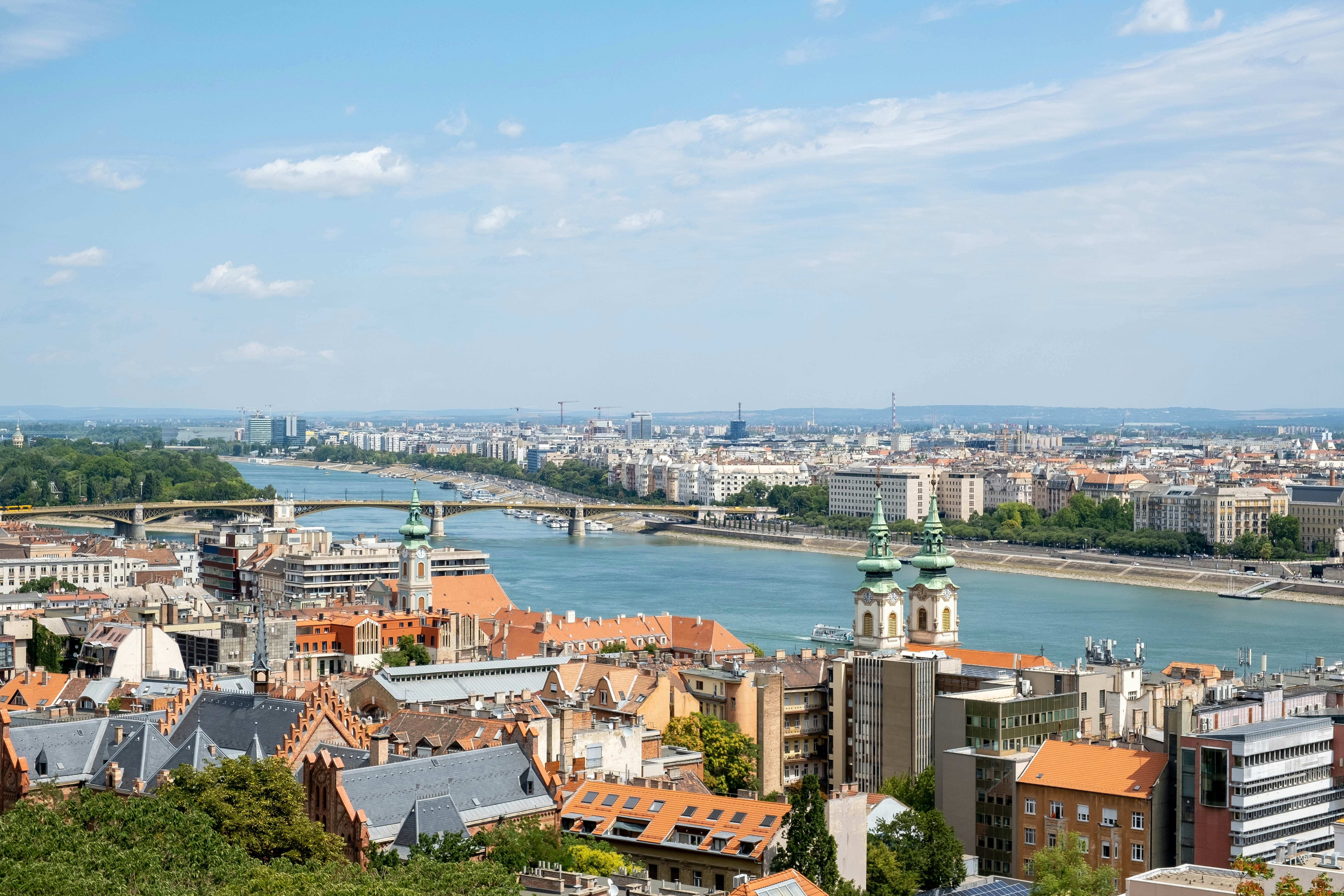 Horizon Cathedral and Riverside Rooftops Over a European Cityscape