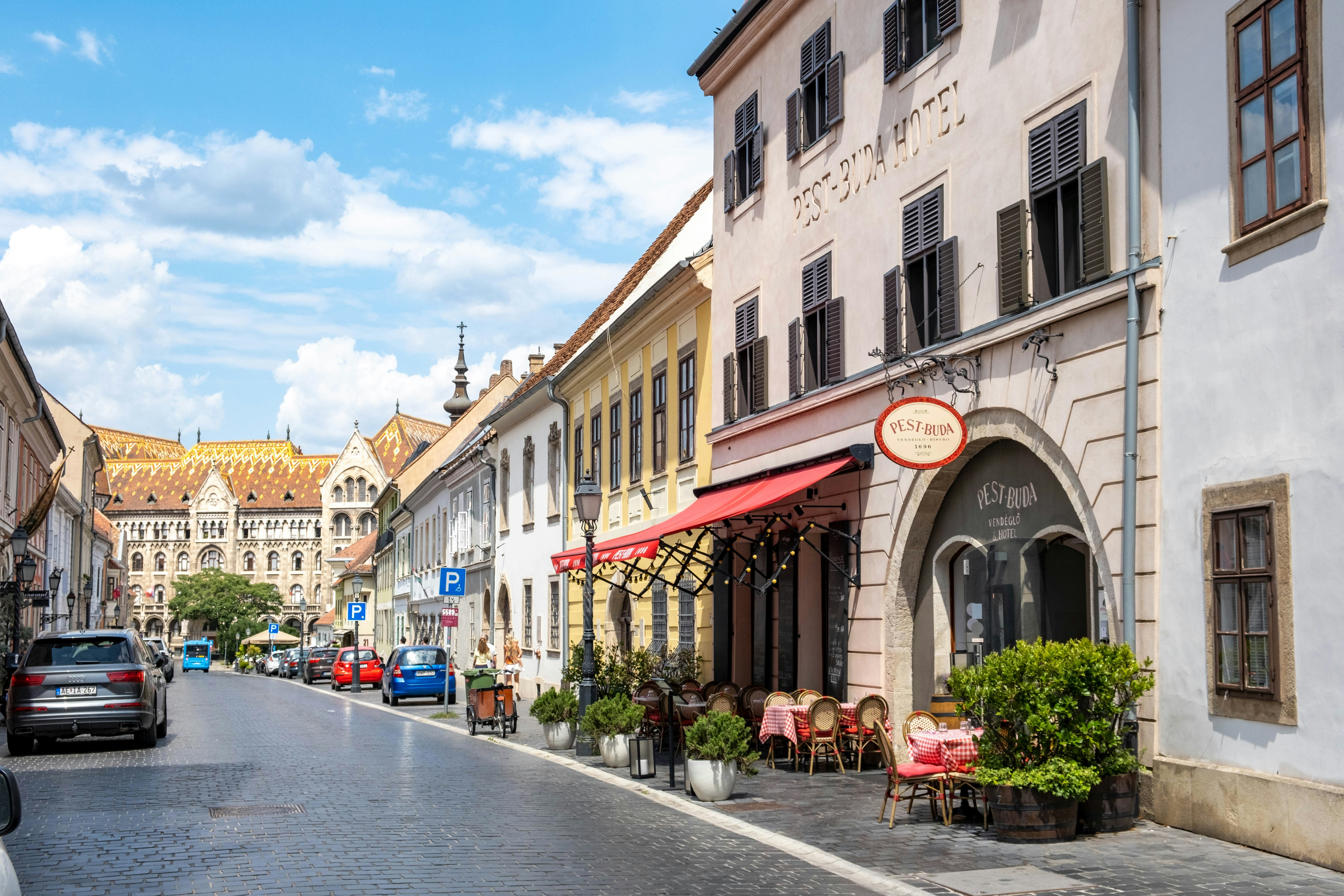 Cobbled Street Café Row: Facades and Arcades in the Sun