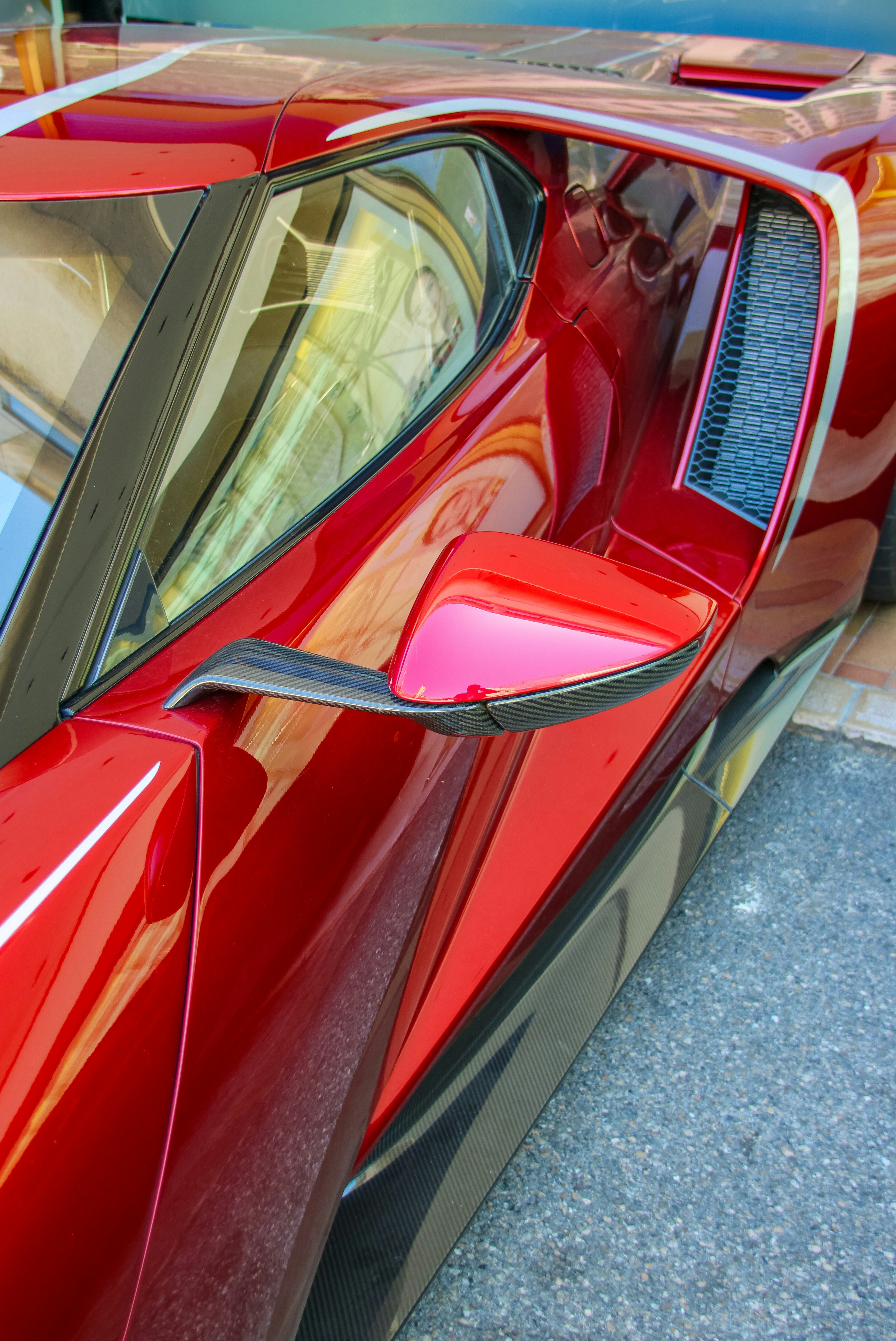 Red Mirage: Curved Car Silhouette and Carbon Details