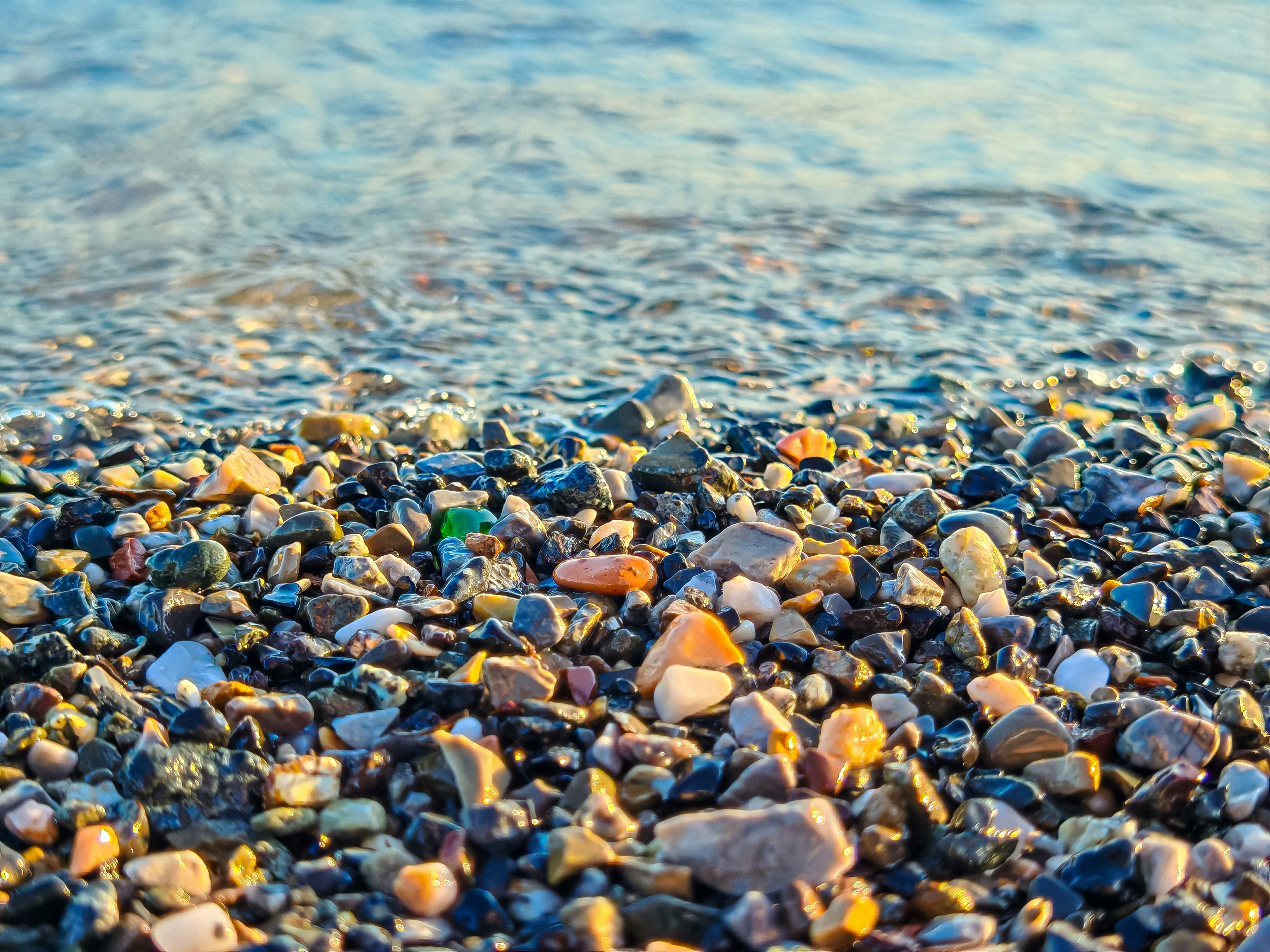 Pebble Mosaic by the Shore at Golden Hour