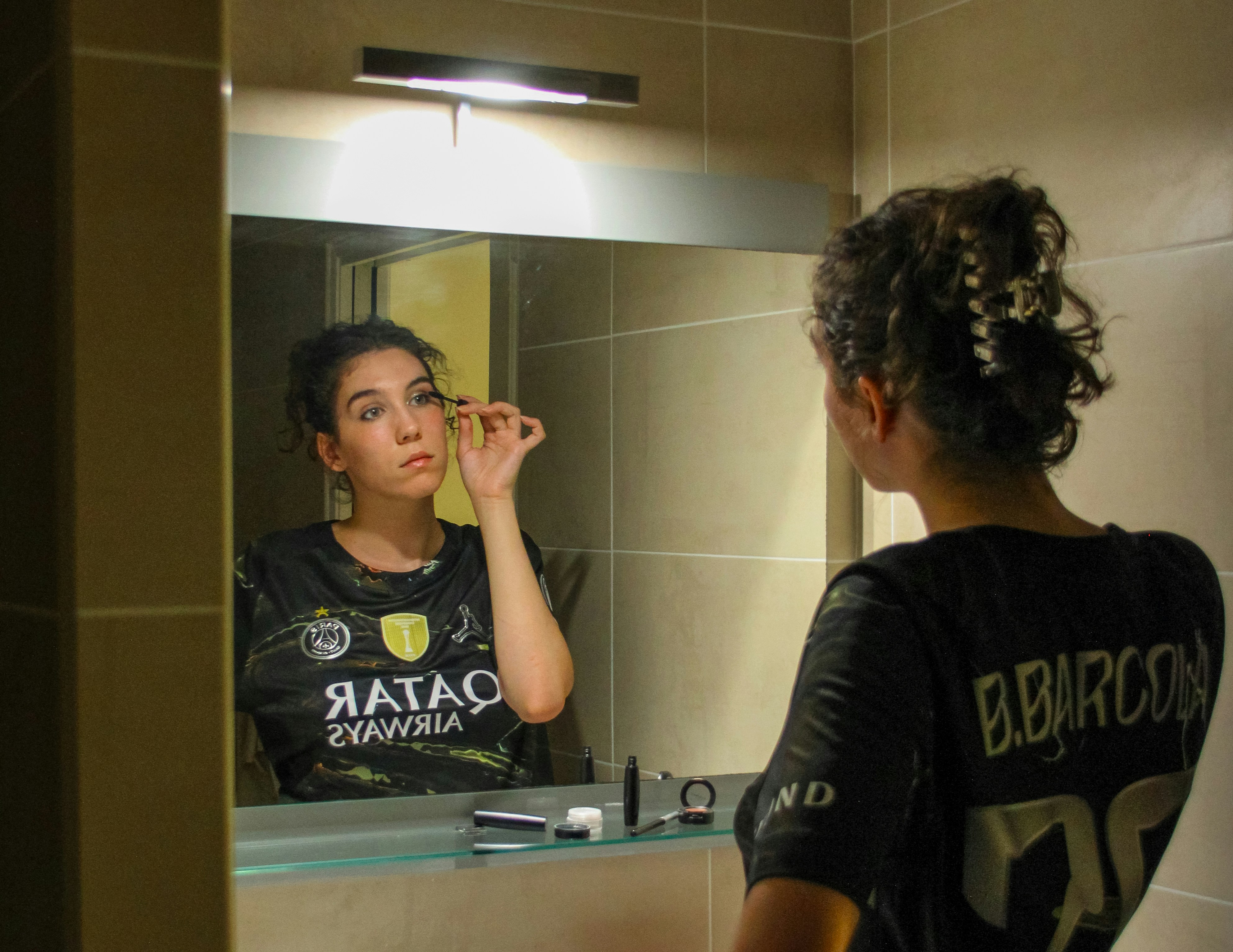 Mirror Moment: Focused Eyes and Craft in the Bathroom