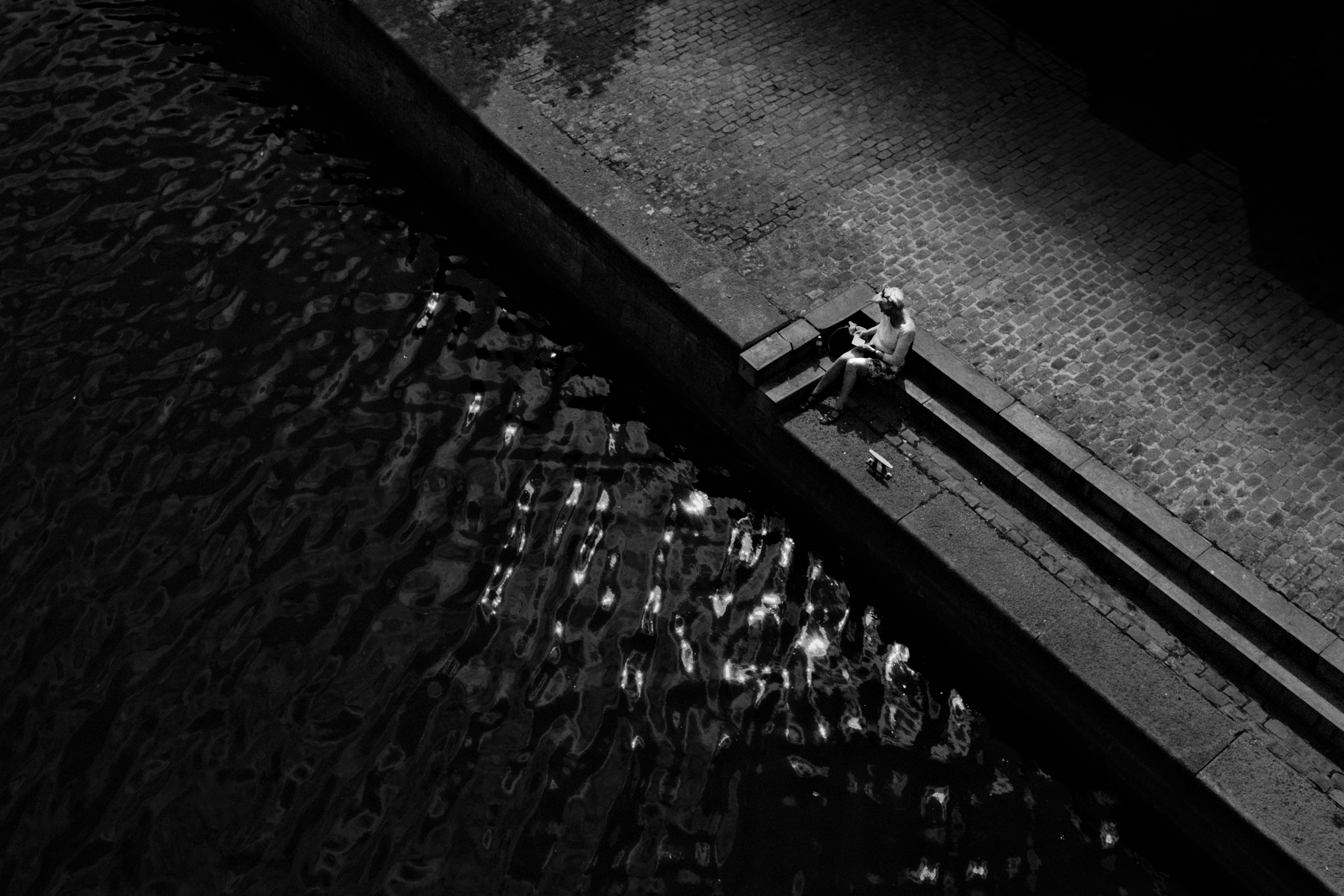 Lone Figure, Quiet Pier: A Diagonal Moment in Mono