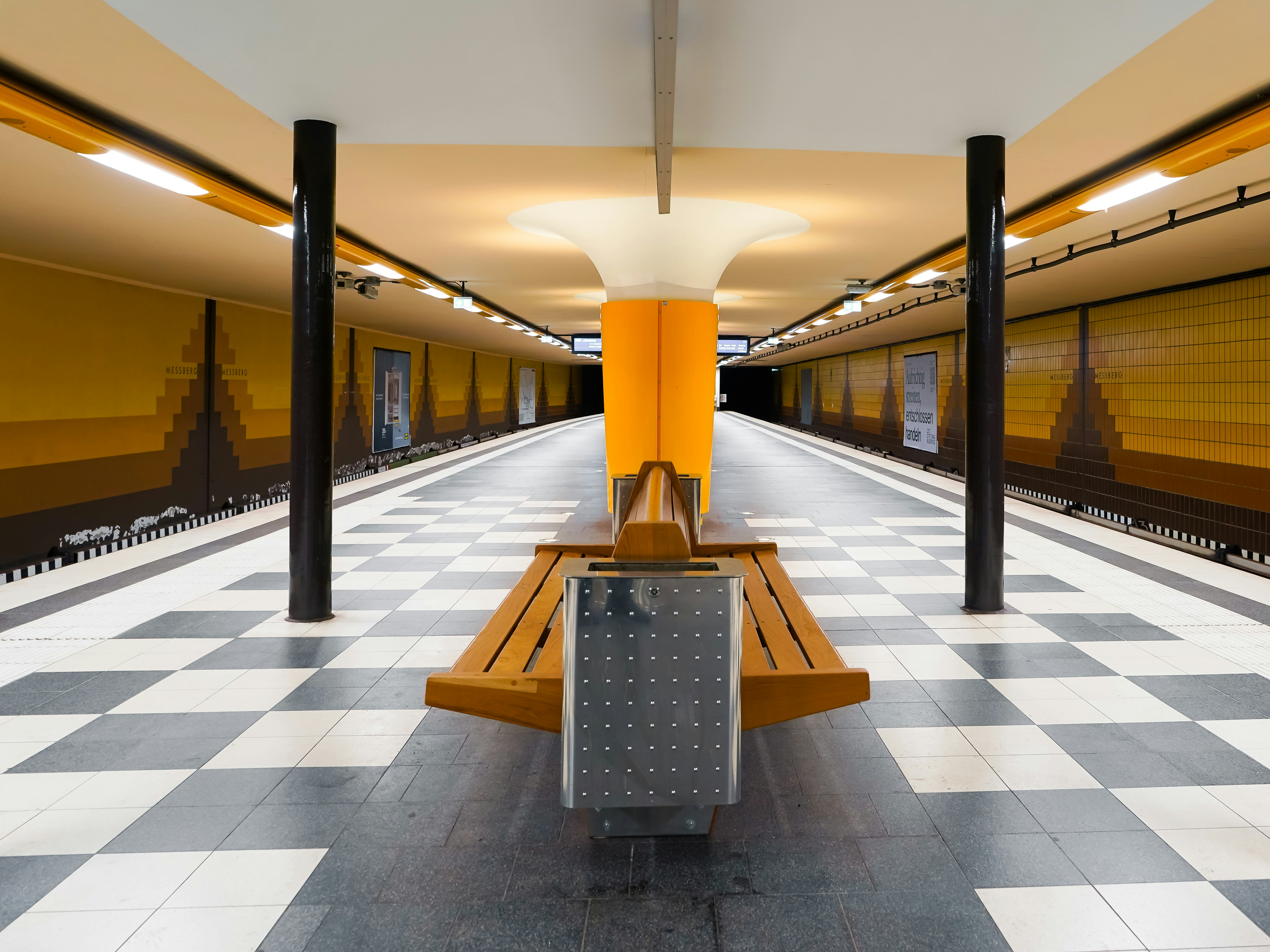 Center Bench in an Empty Subway Shop: Symmetry Under Fluorescent Light