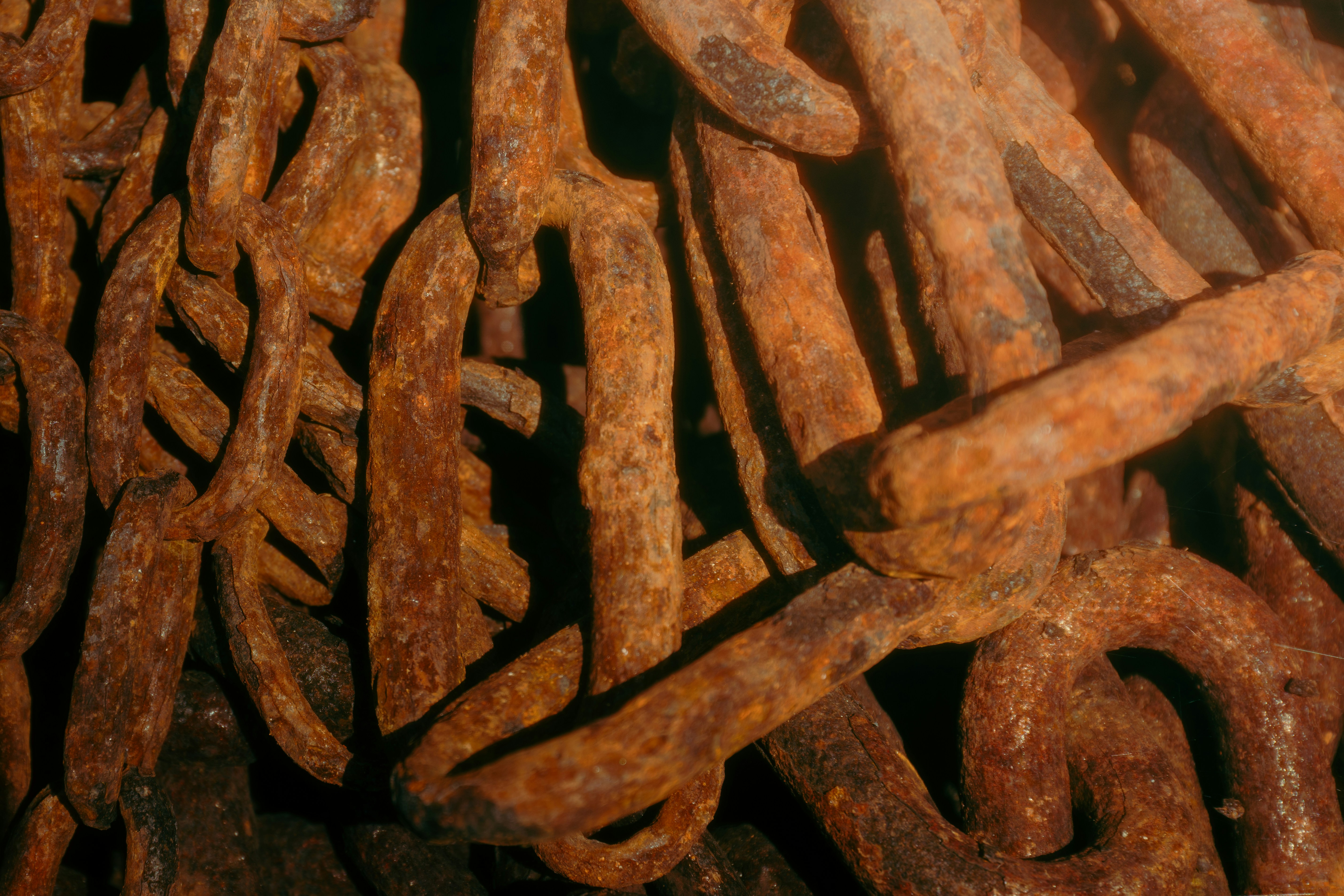 Rusted Tangle: A Close-Up of Weathered Chains