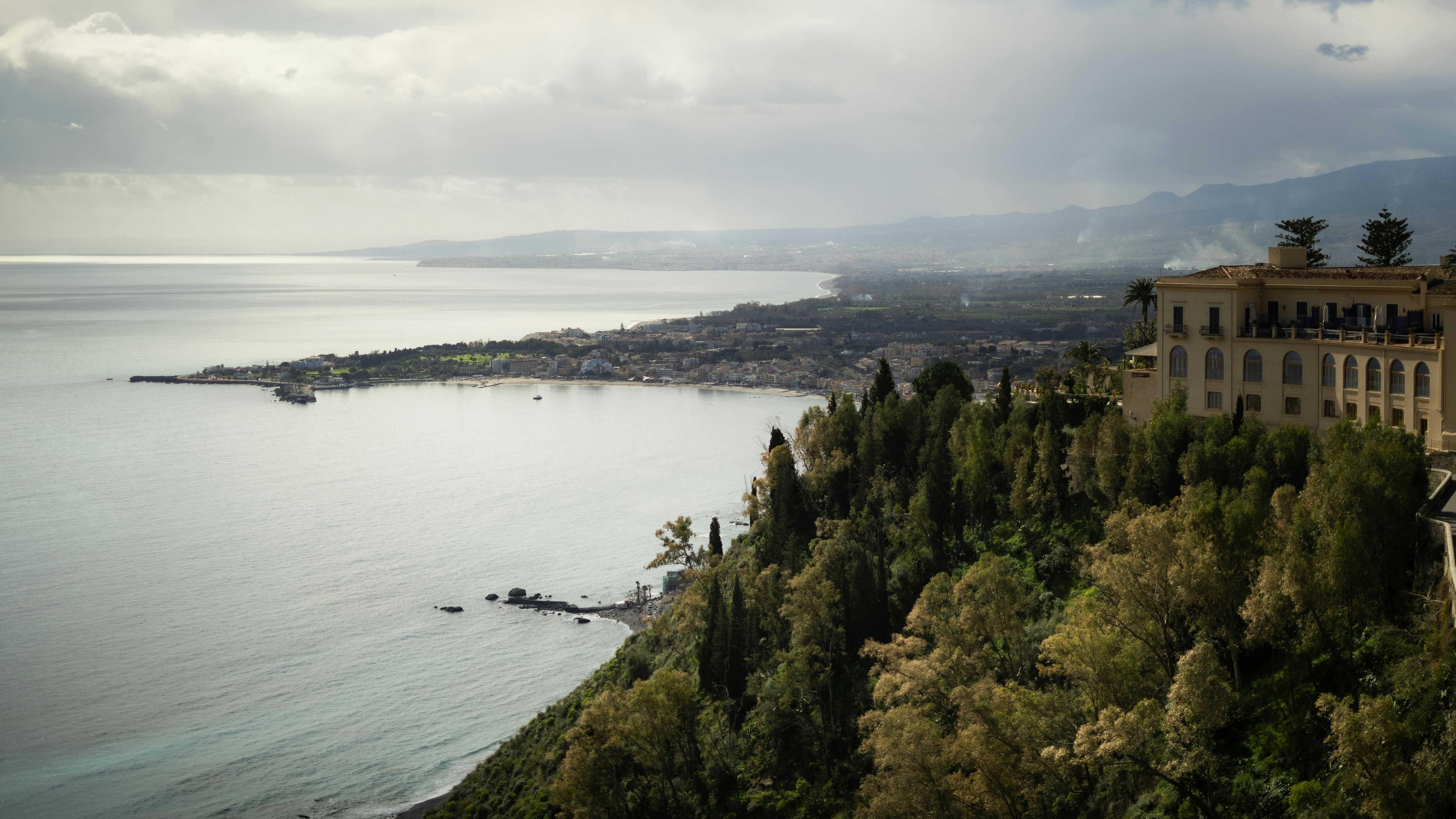 Terraced hillside over calm Mediterranean tides