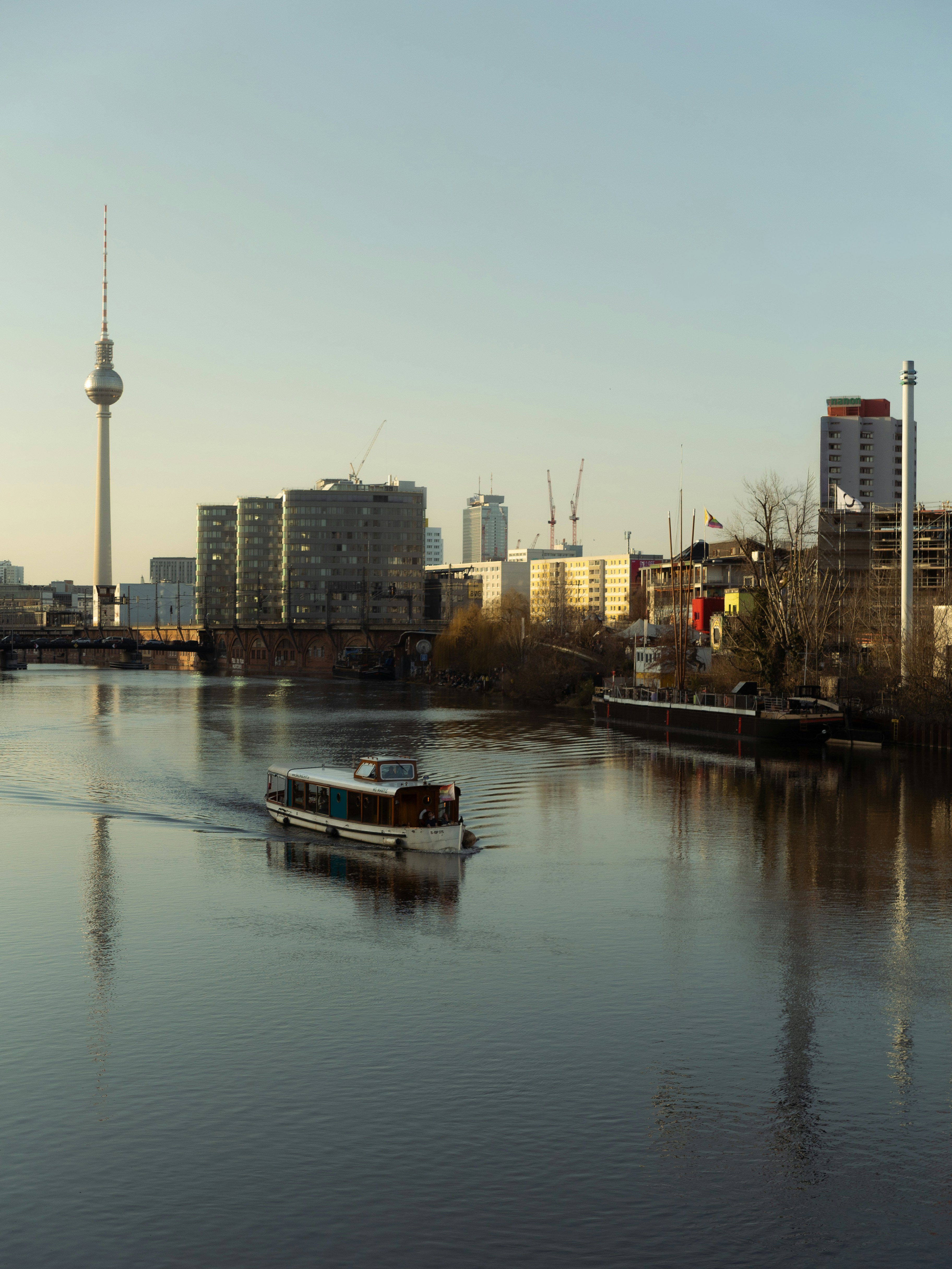 River Passage Beneath a Modern Skyline